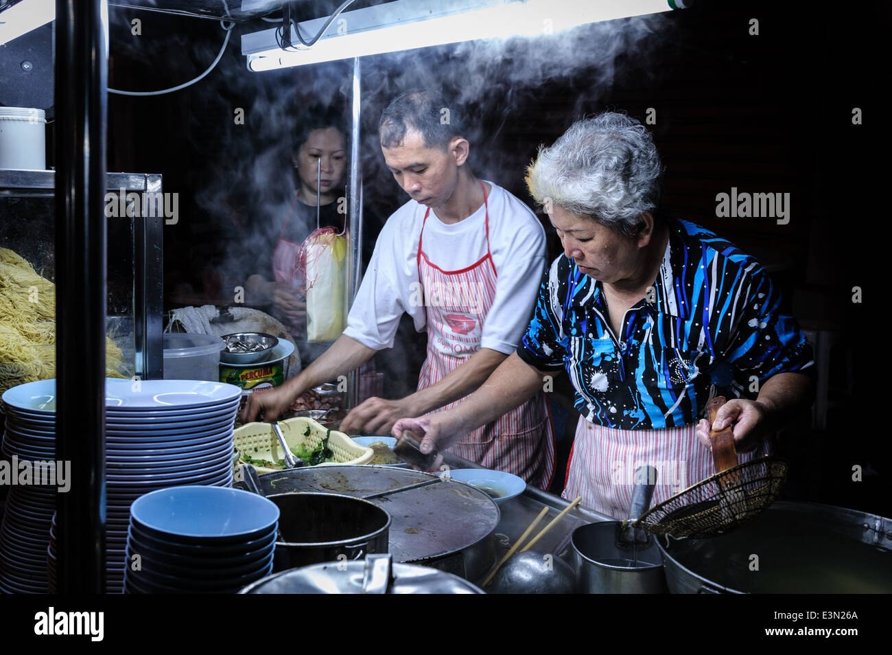 People selling noodles in the streets of Penang, Malaysia Stock Photo ...