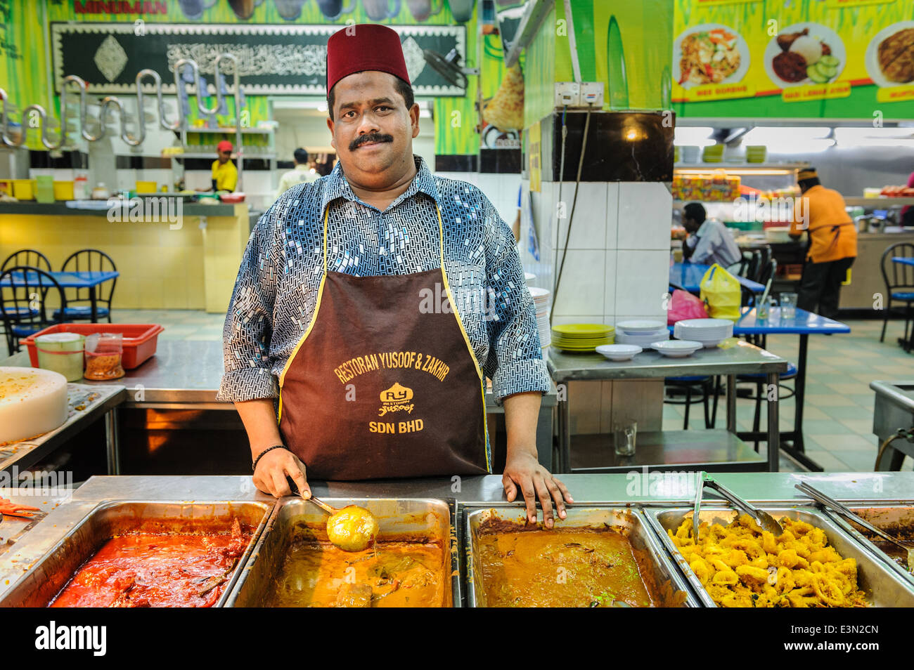 cook in a restaurant serving food, Kuala Lumpur, Malaysia Stock Photo ...