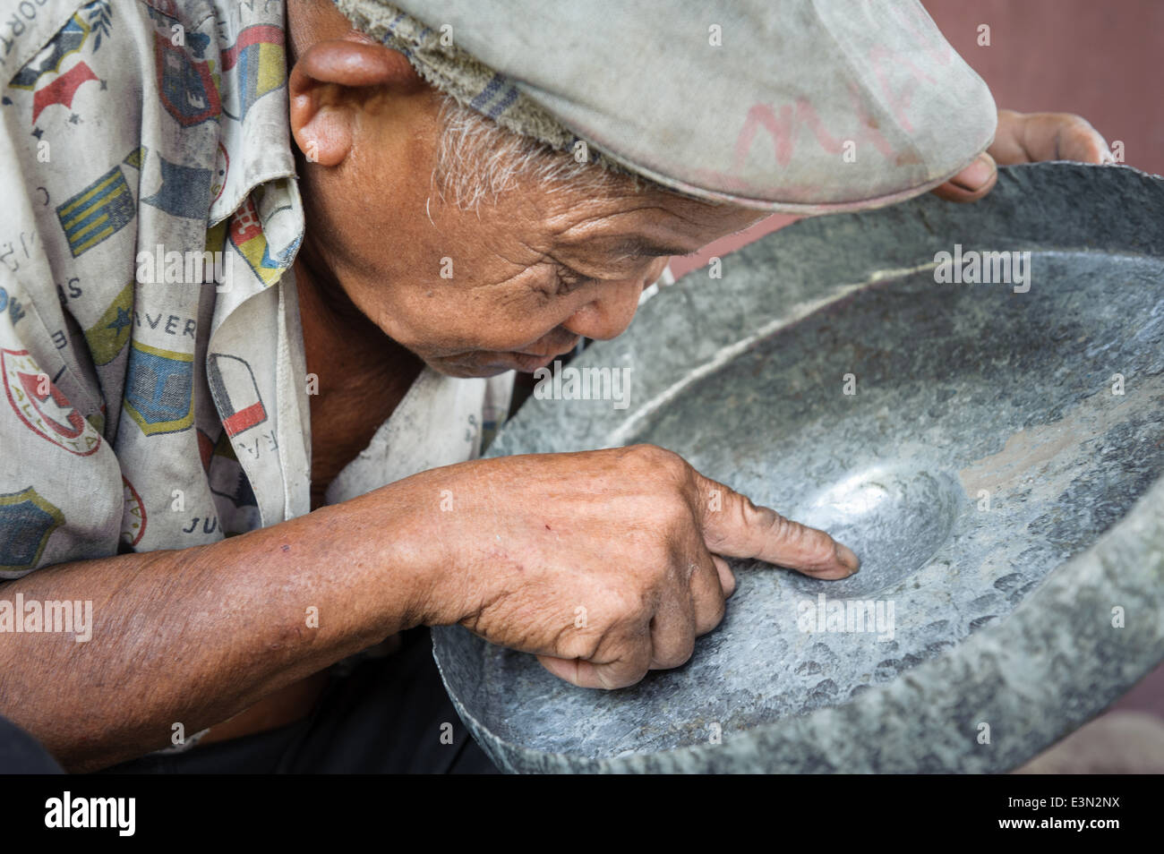 Man making gong, checking its quality, Borneo, Malaysia Stock Photo - Alamy