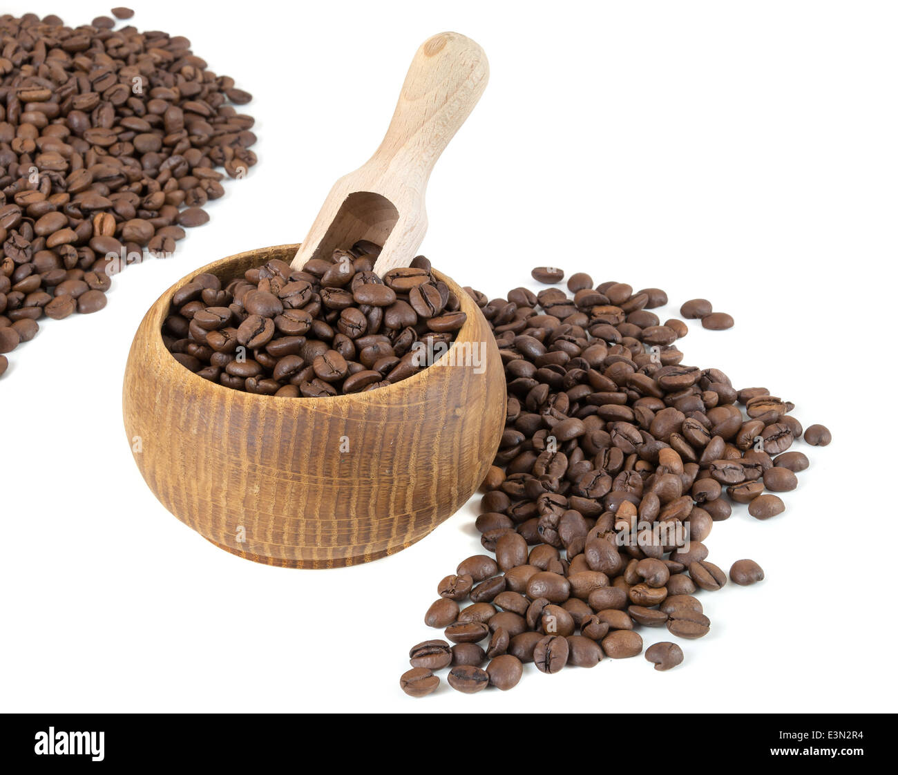 Coffee beans in bowl with wooden shovel isolated on white background ...