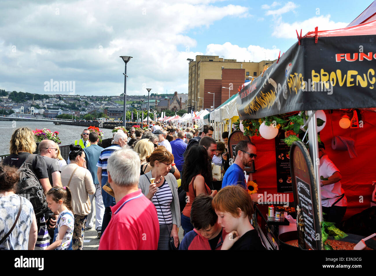 Crowds of people visit the outdoor markets on Queens Quay, Derry ...