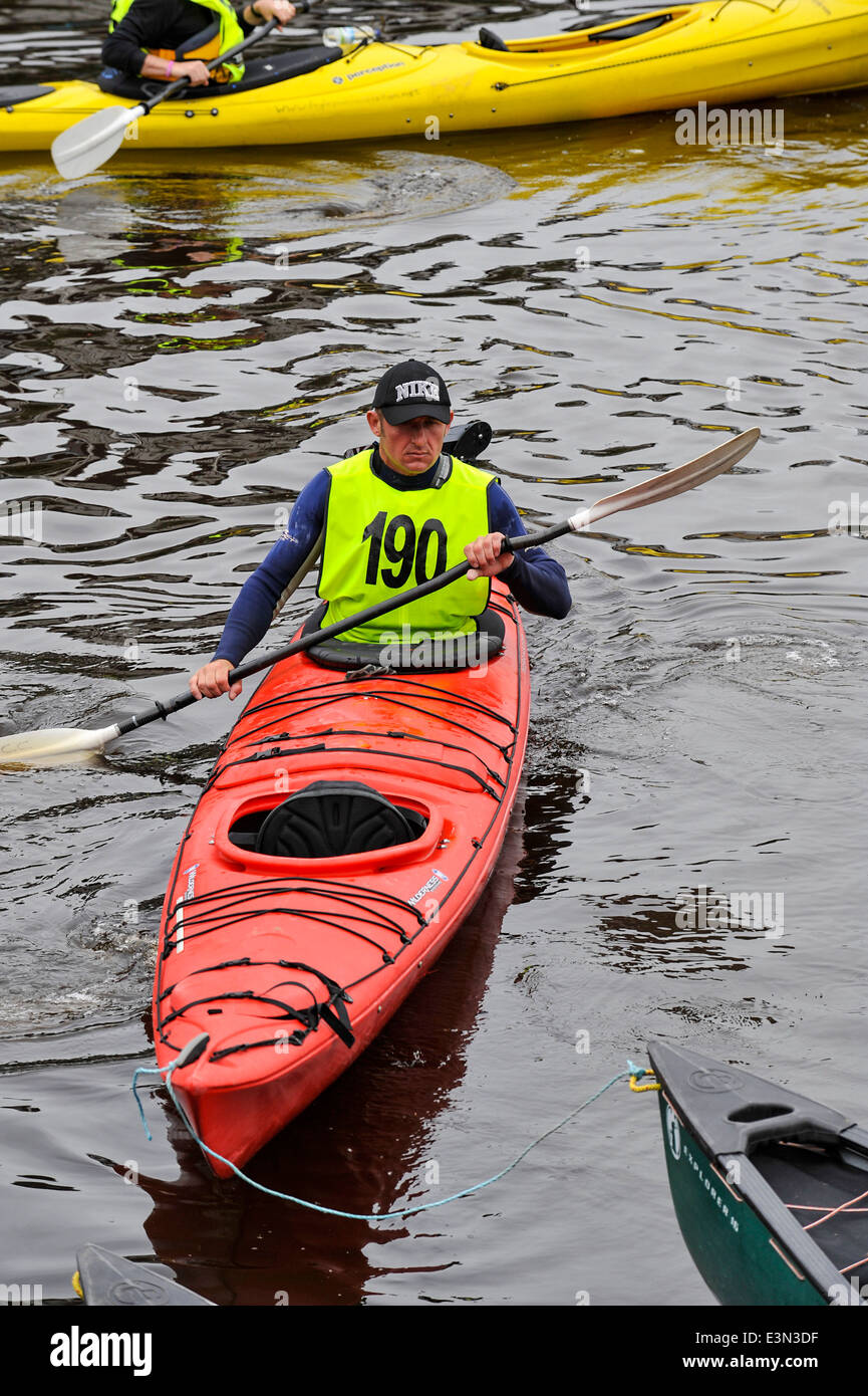 Man paddling two man canoe on the River Foyle, Derry, Londonderry ...