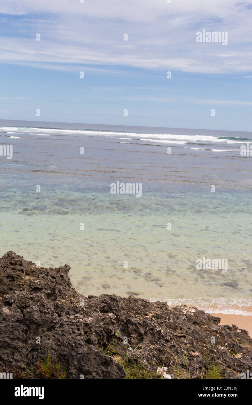 Beautiful tropical beach with lush vegetation fringing golden sand and ...