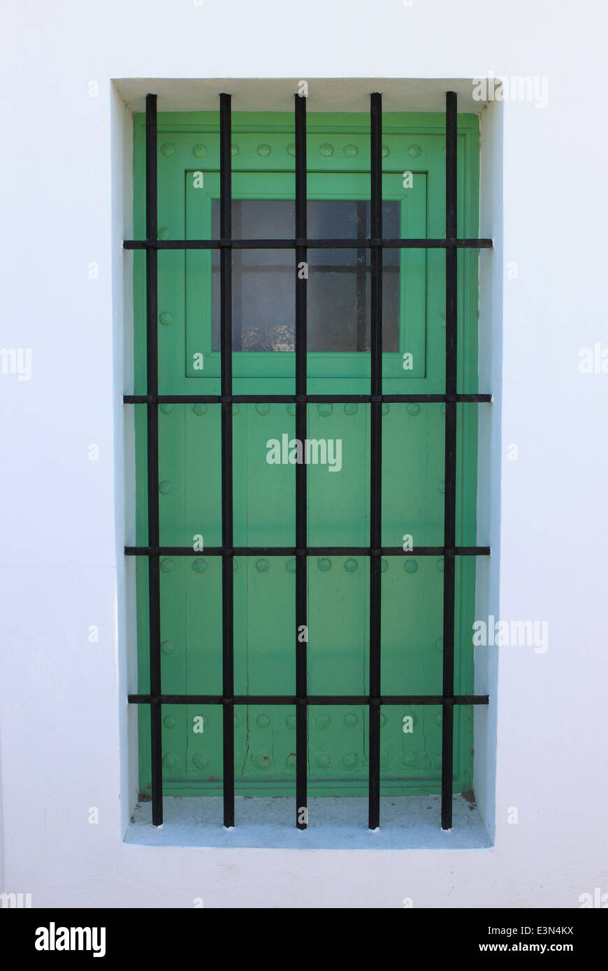 Closed window of a prison with bars Stock Photo - Alamy