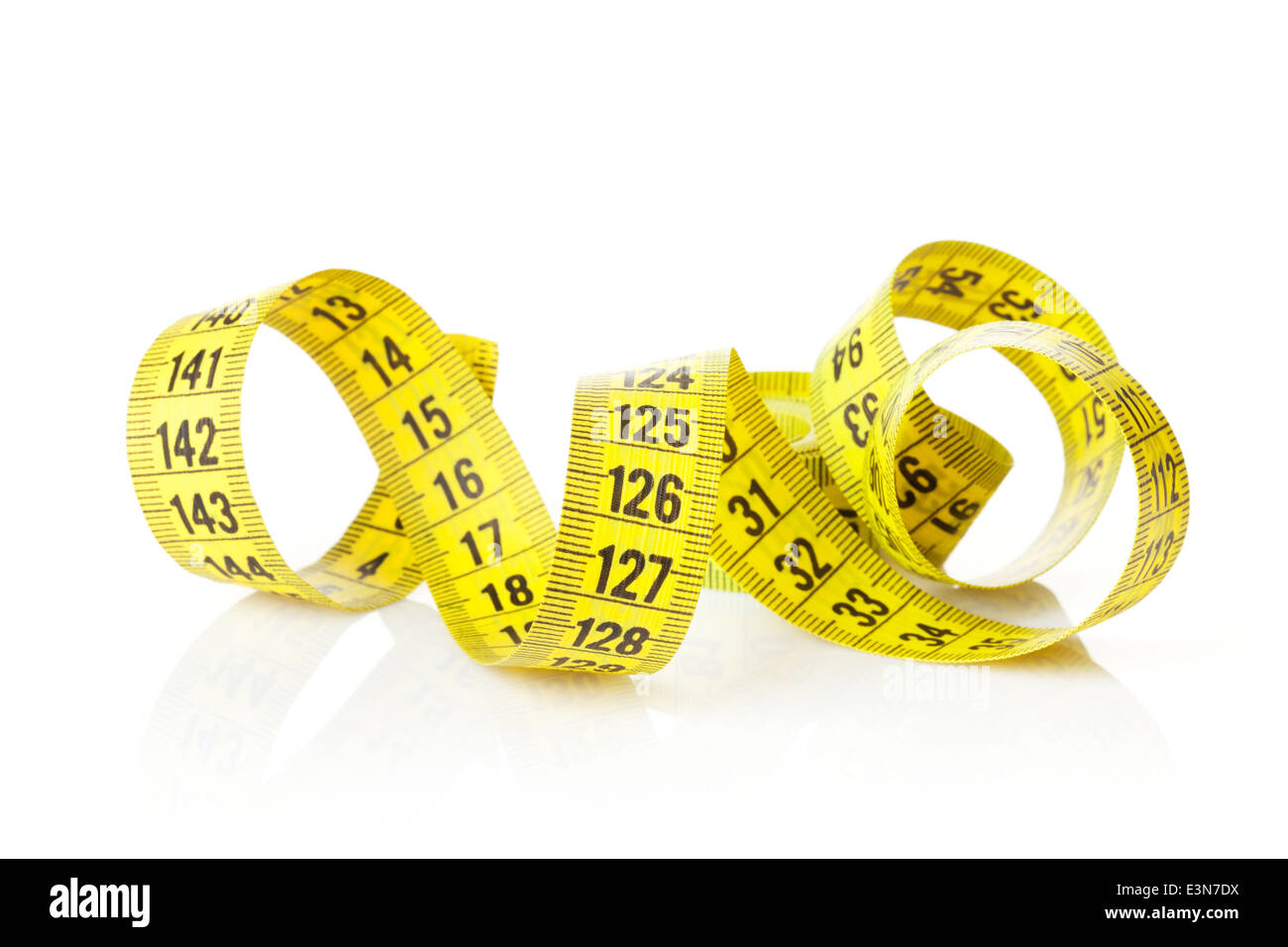 Yellow measure tape. Isolated on white background Stock Photo - Alamy