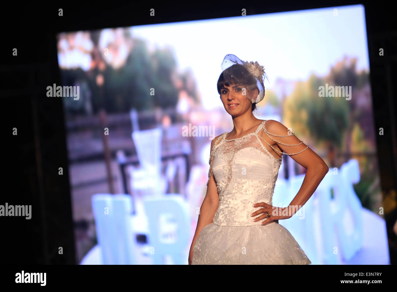 Bethlehem. 25th June, 2014. A Palestinian model displays a dress during ...