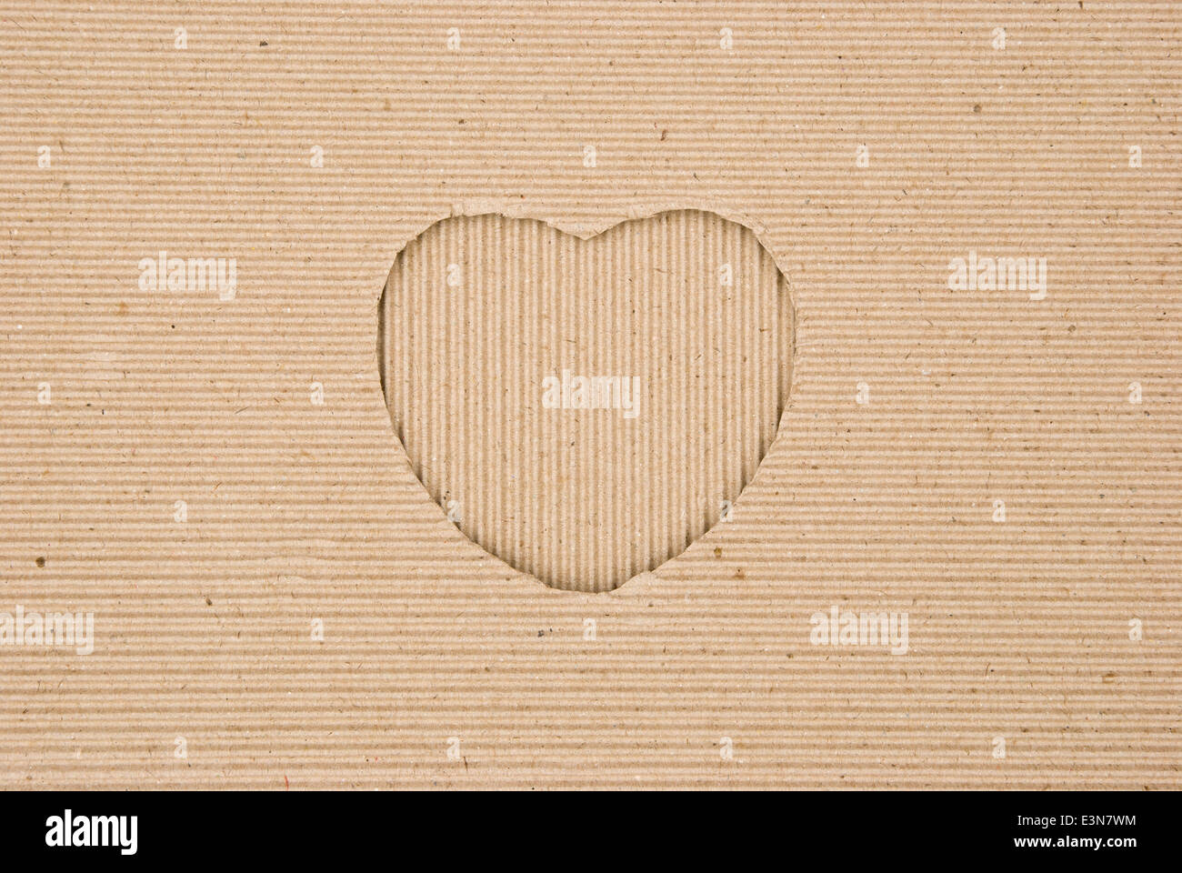 cardboard corrugated with a heart shape cut out, vertical Stock Photo ...