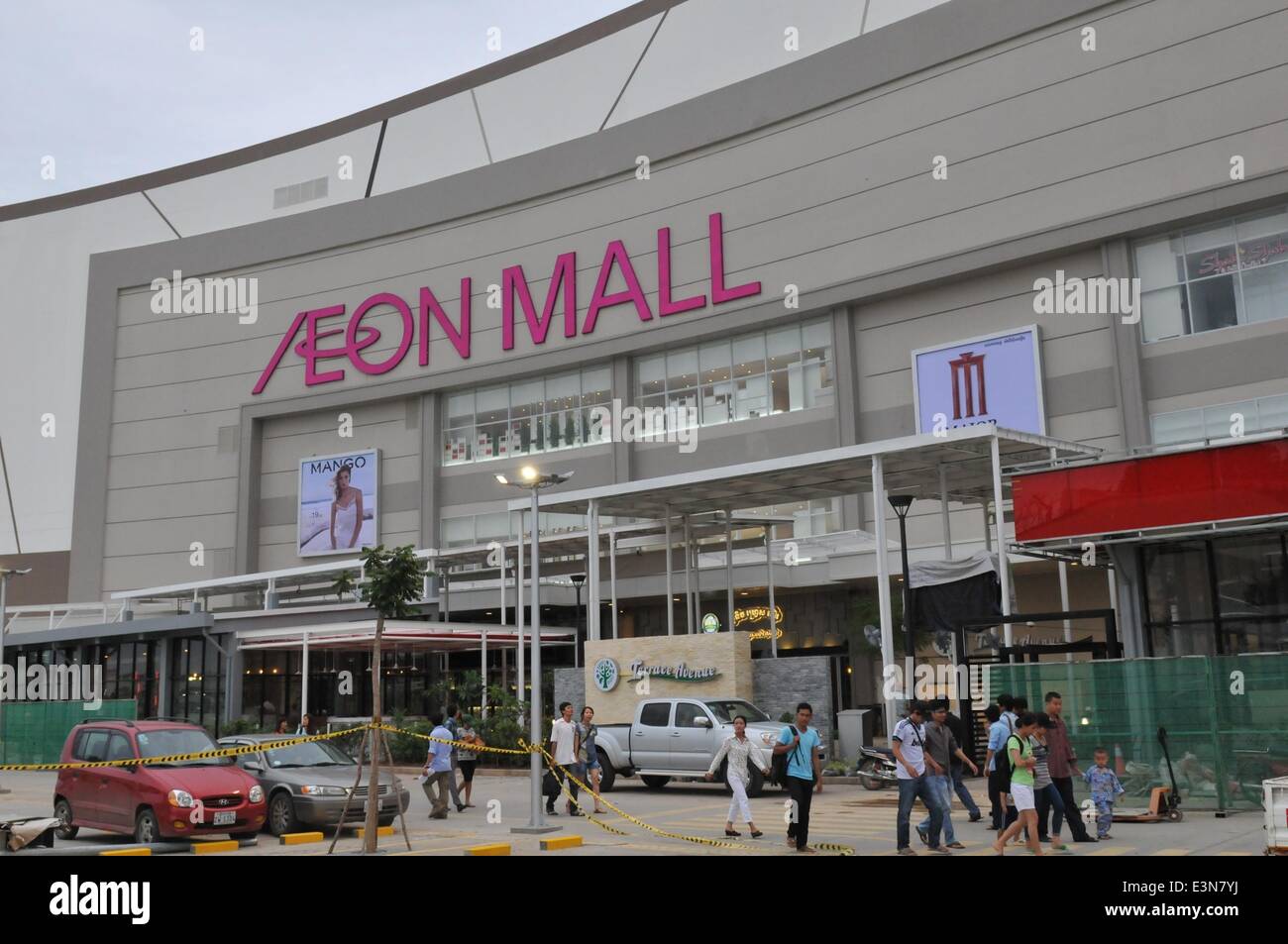 Phnom Penh, Cambodia. 24th June, 2014. People walk in front of AEON ...