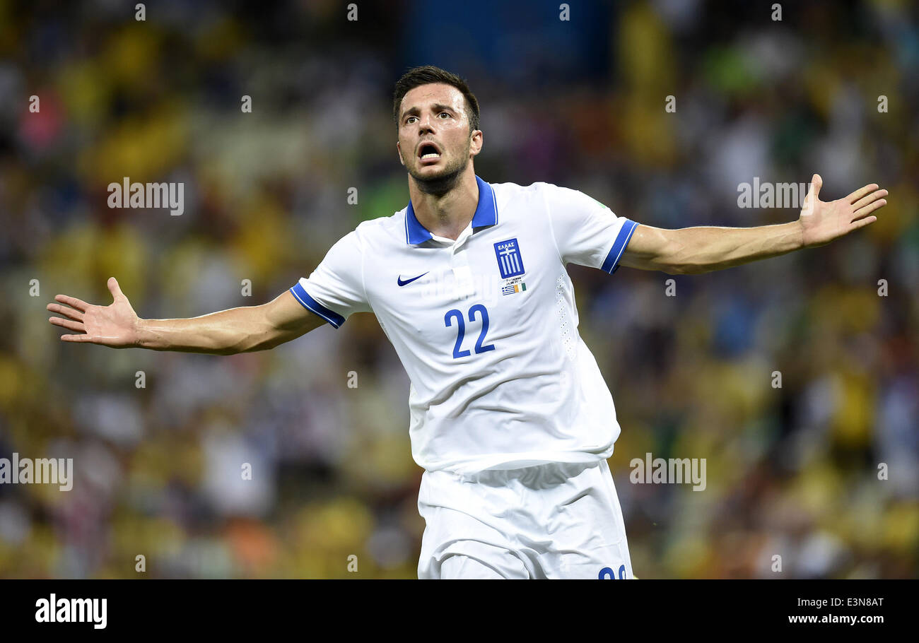 Fortaleza, Brazil. 24th June, 2014. Greece's Andreas Samaris celebrates ...