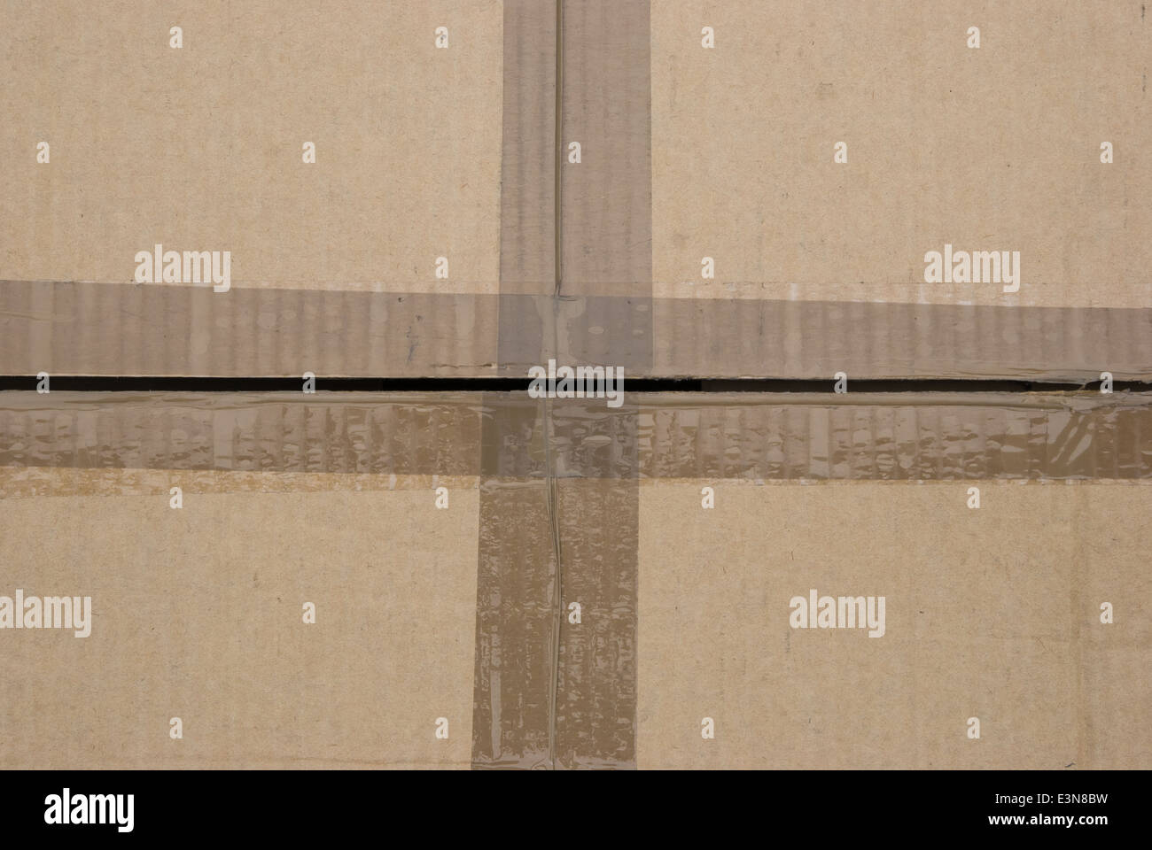 carton stuck with tape Stock Photo - Alamy
