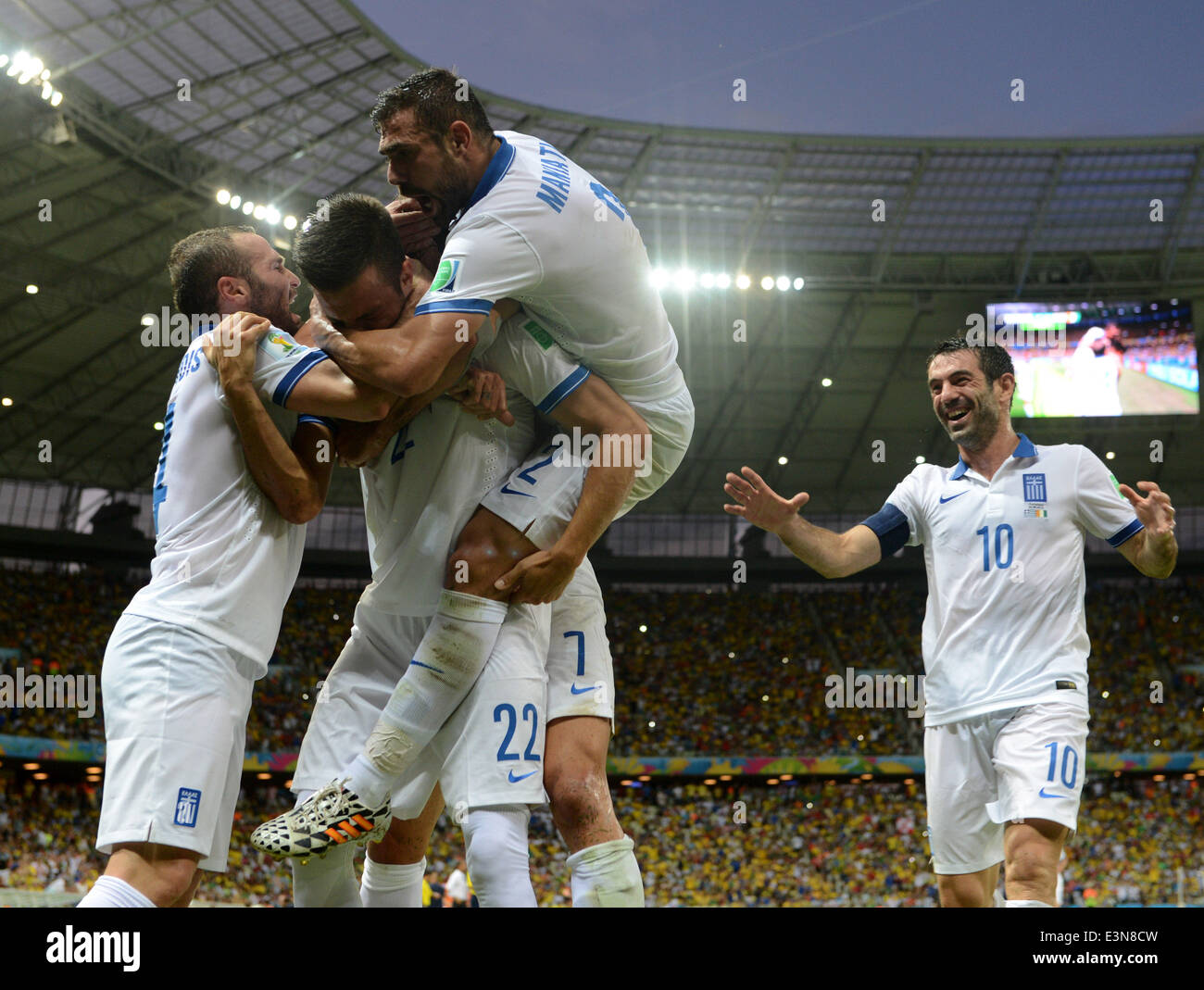 Fortaleza, Brazil. 24th June, 2014. Greece's Andreas Samaris (C, front ...
