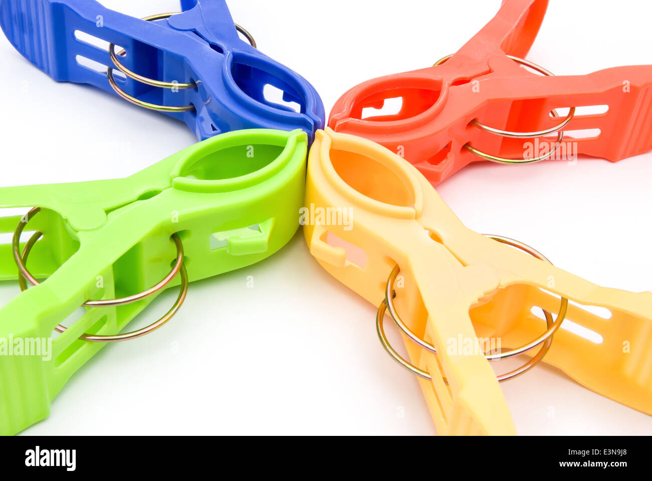 colorful clothespins line up on white Stock Photo - Alamy