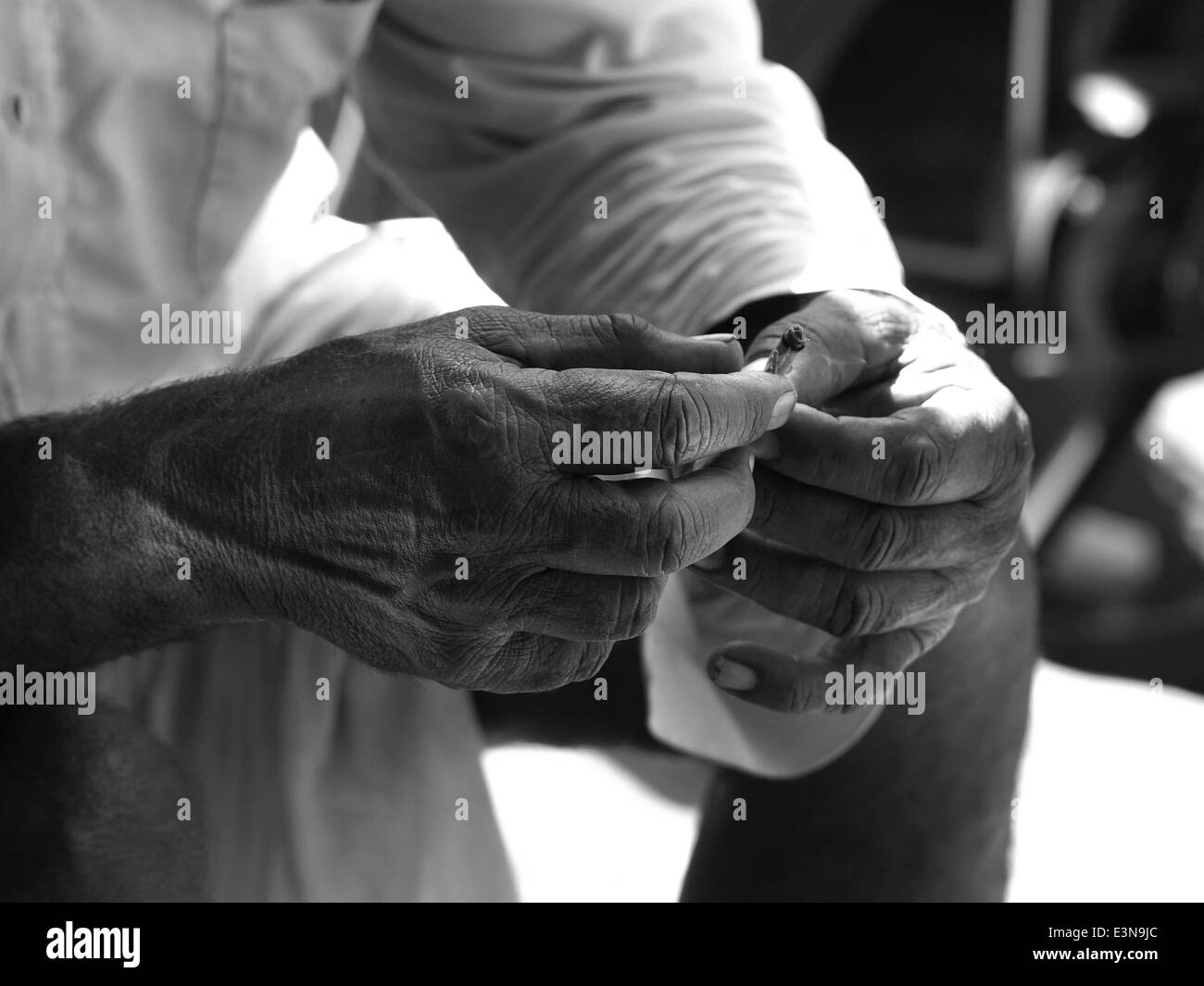 Hand holding cigarette Black and White Stock Photos & Images - Alamy