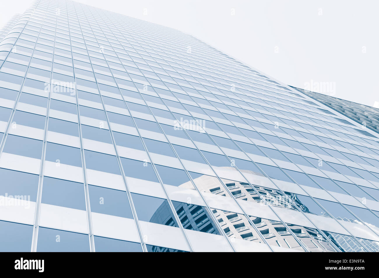 View of modern blue colored building made of glass Stock Photo - Alamy