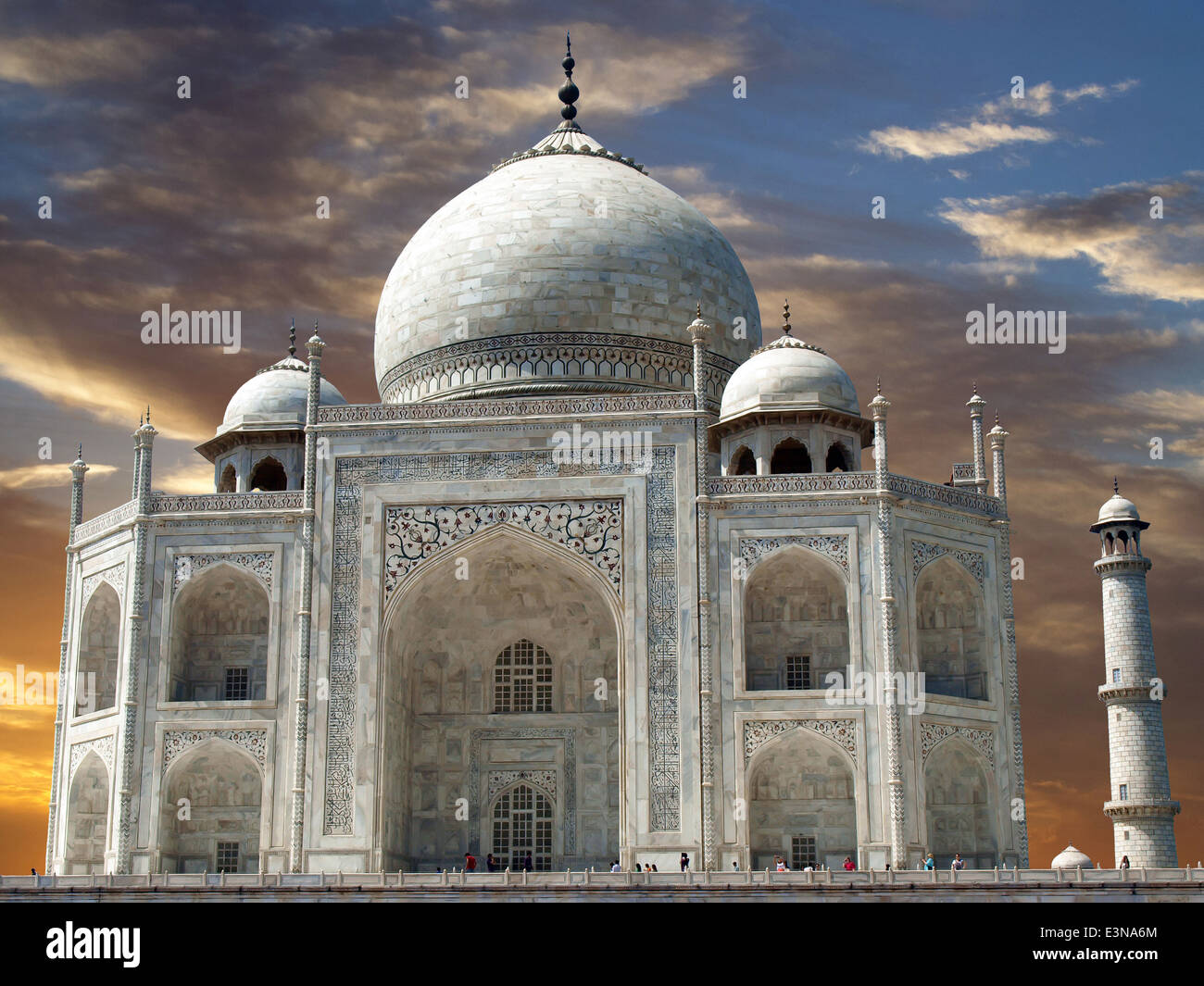 colorfull sunset with orange and blue clouds and view of Taj Mahal ...