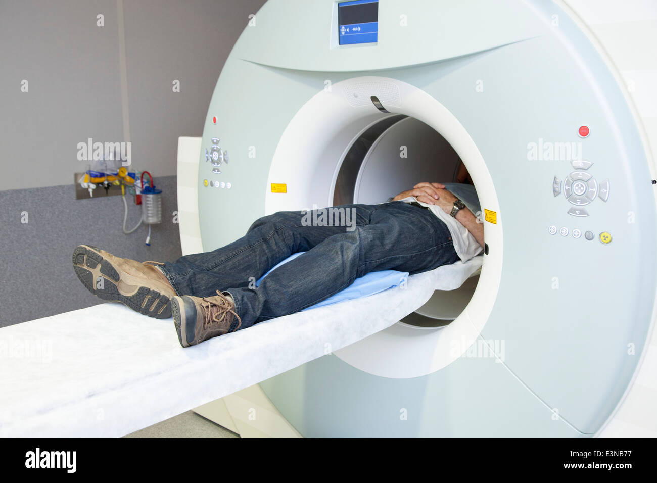 Low section of male patient lying in MRI scanner Stock Photo - Alamy