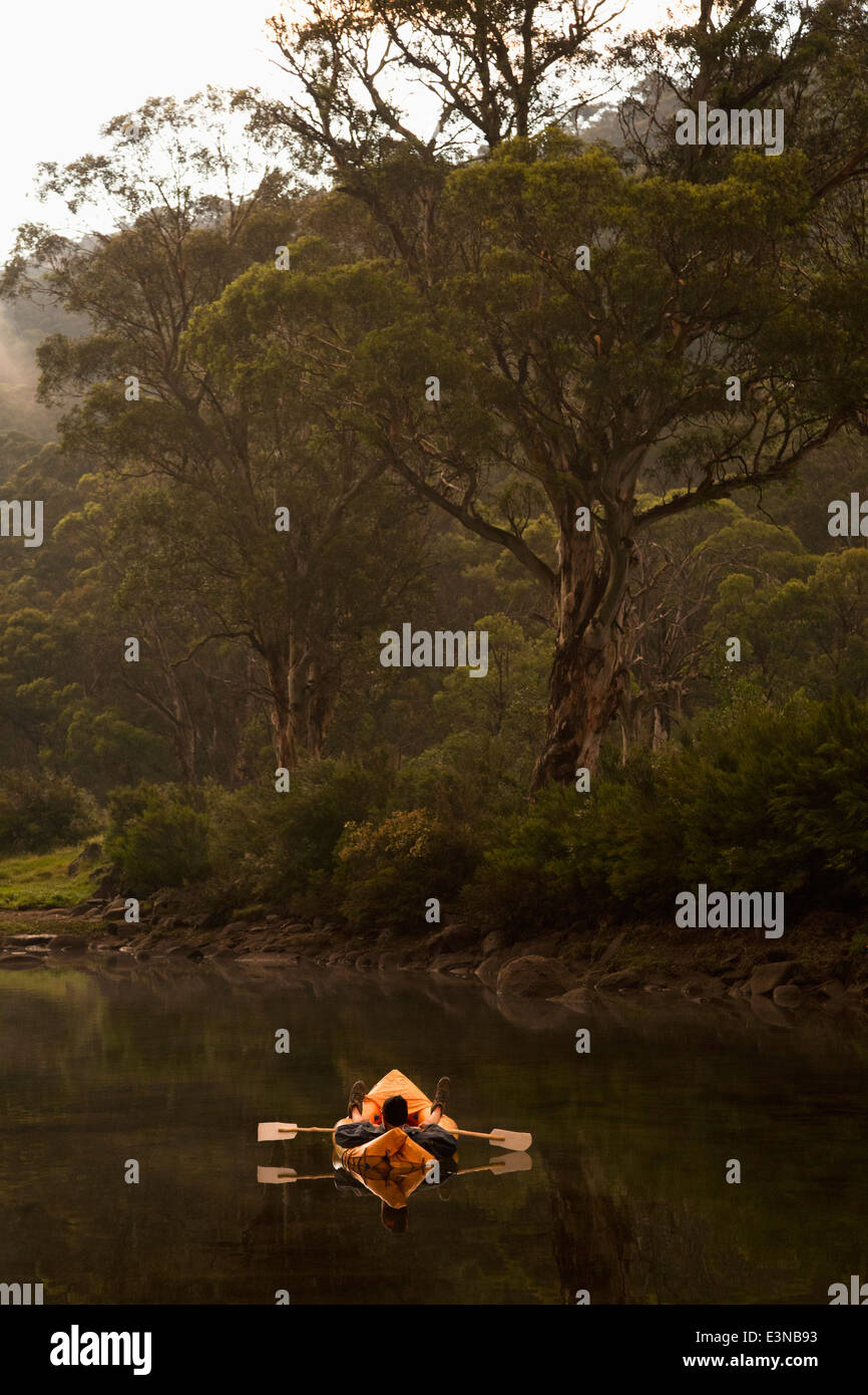 Man relaxing in inflatable raft on lake Stock Photo - Alamy