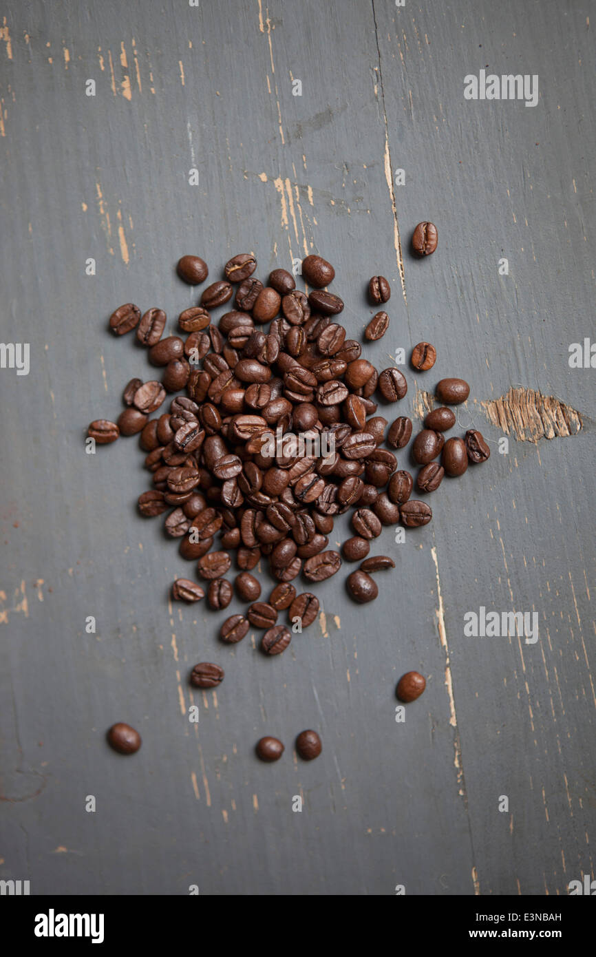Roasted coffee beans on table Stock Photo - Alamy