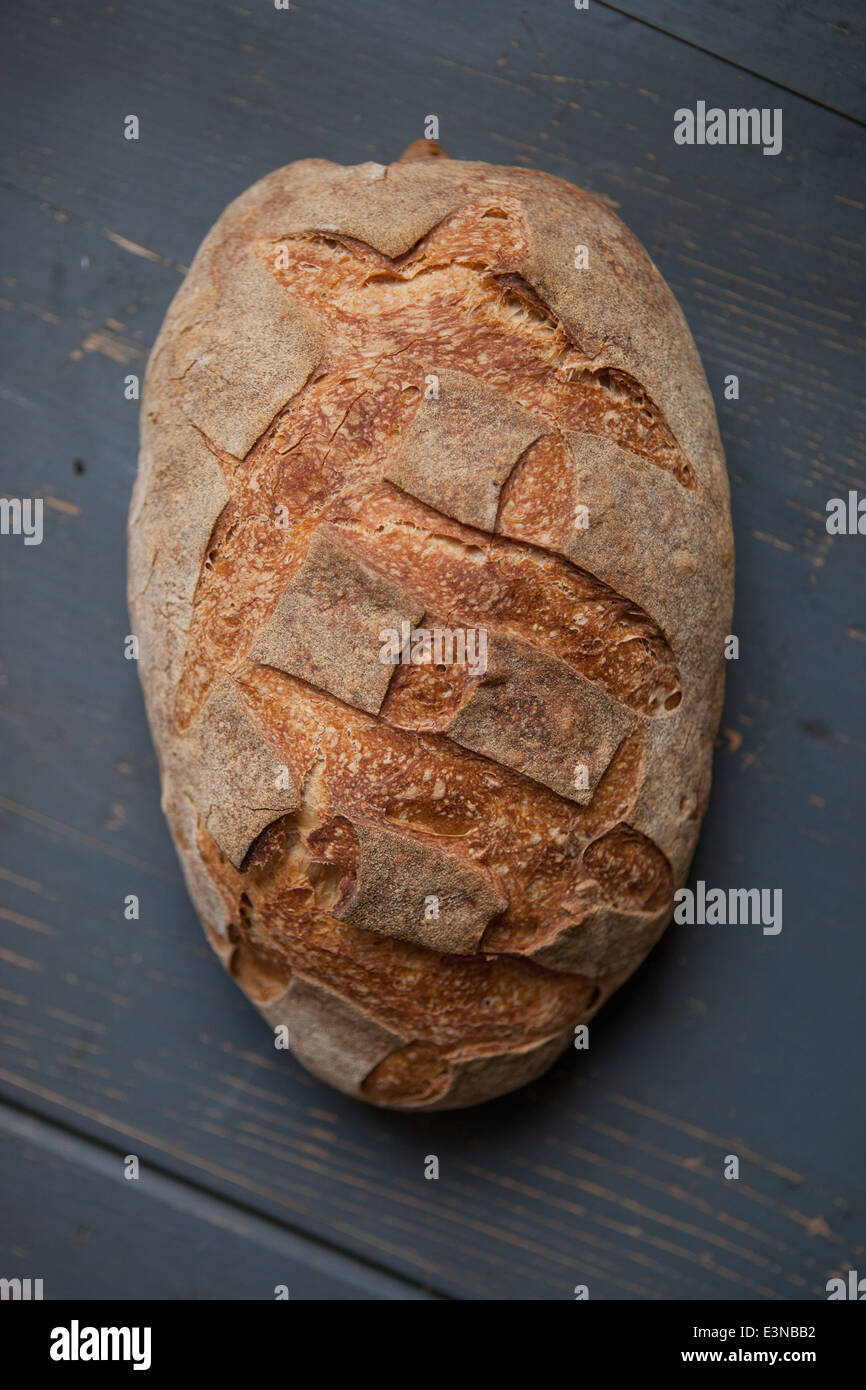 High angle view of bread loaf on table Stock Photo - Alamy