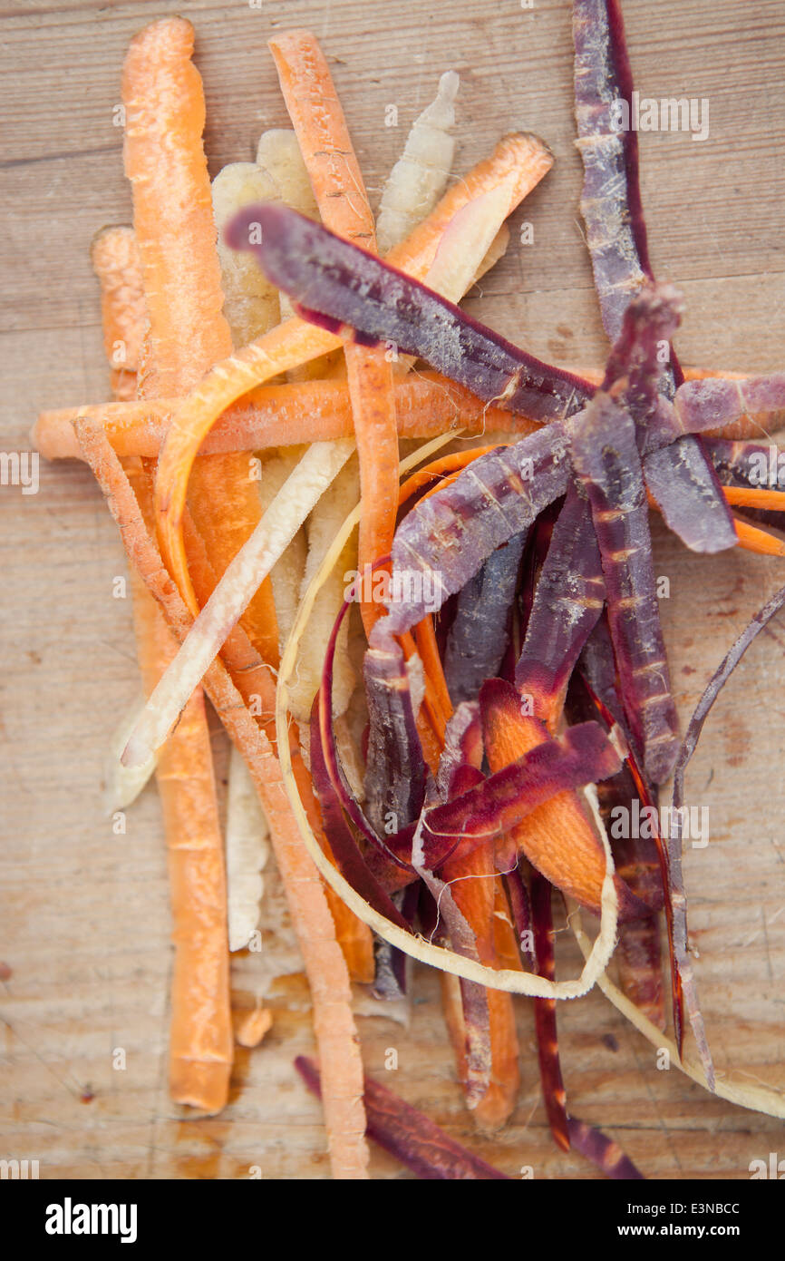 Various vegetable peels on wooden table Stock Photo - Alamy
