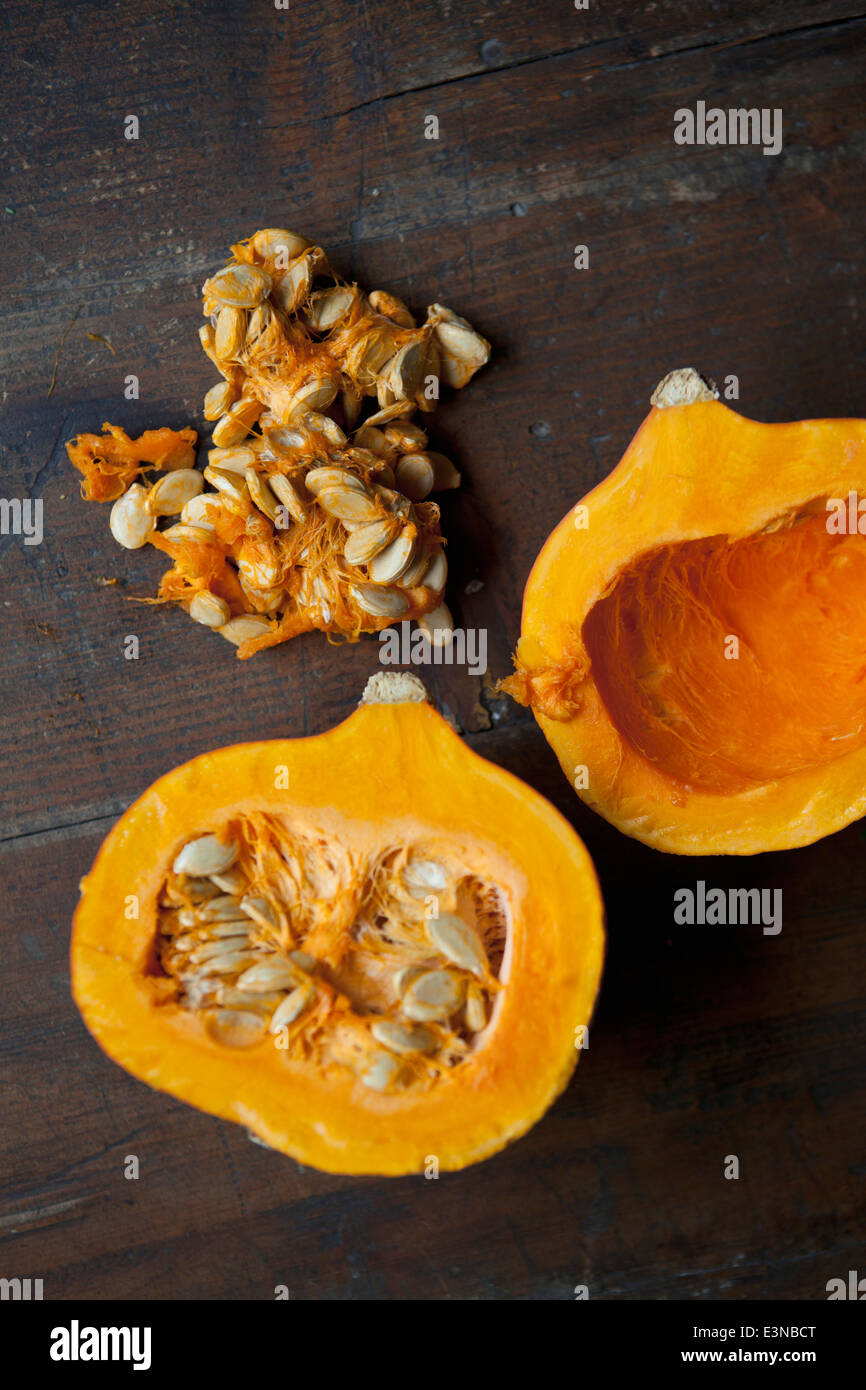 Directly above shot of kuri squash halves on table Stock Photo - Alamy