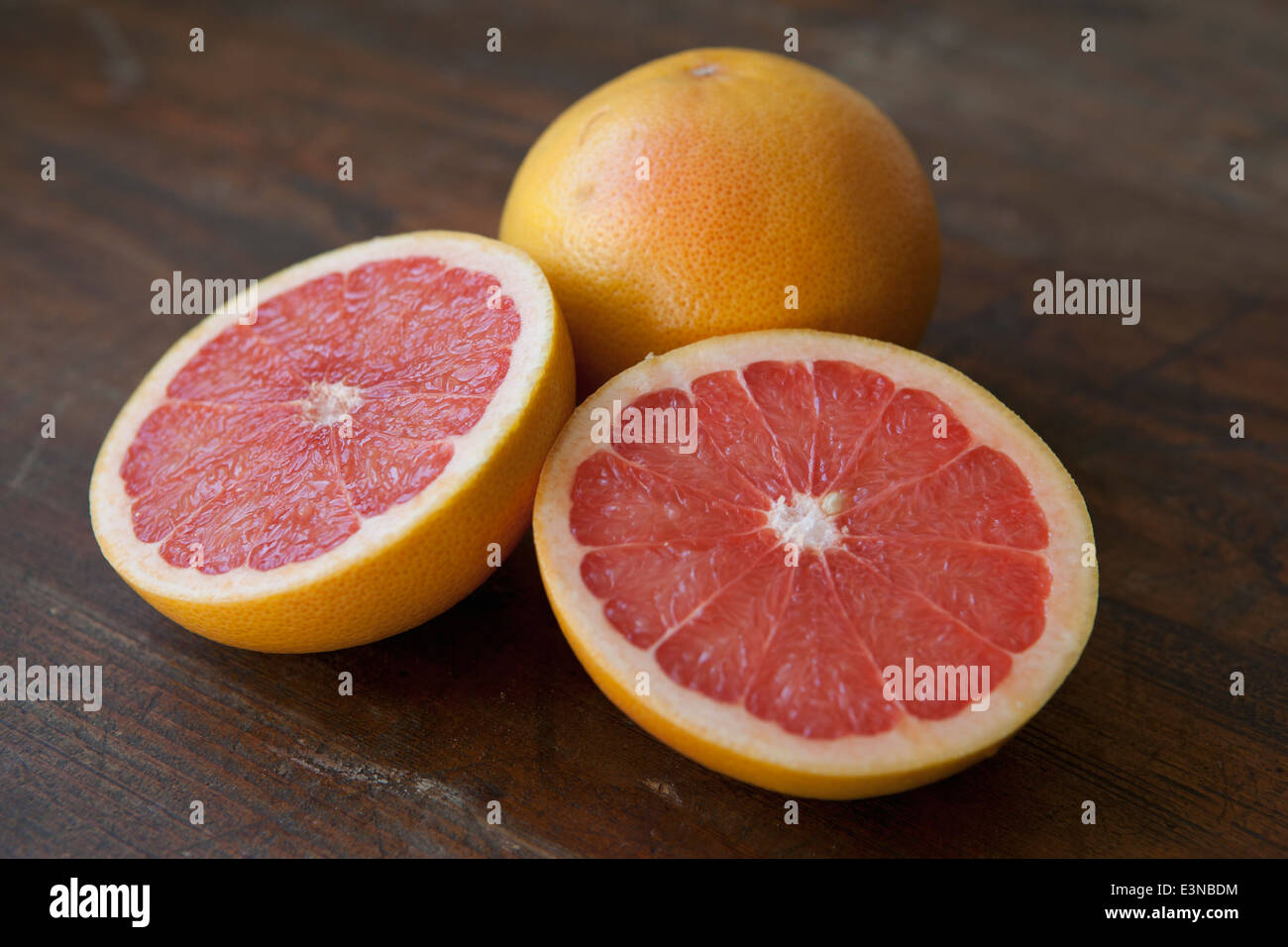 Close-up of pink grapefruits on table Stock Photo - Alamy