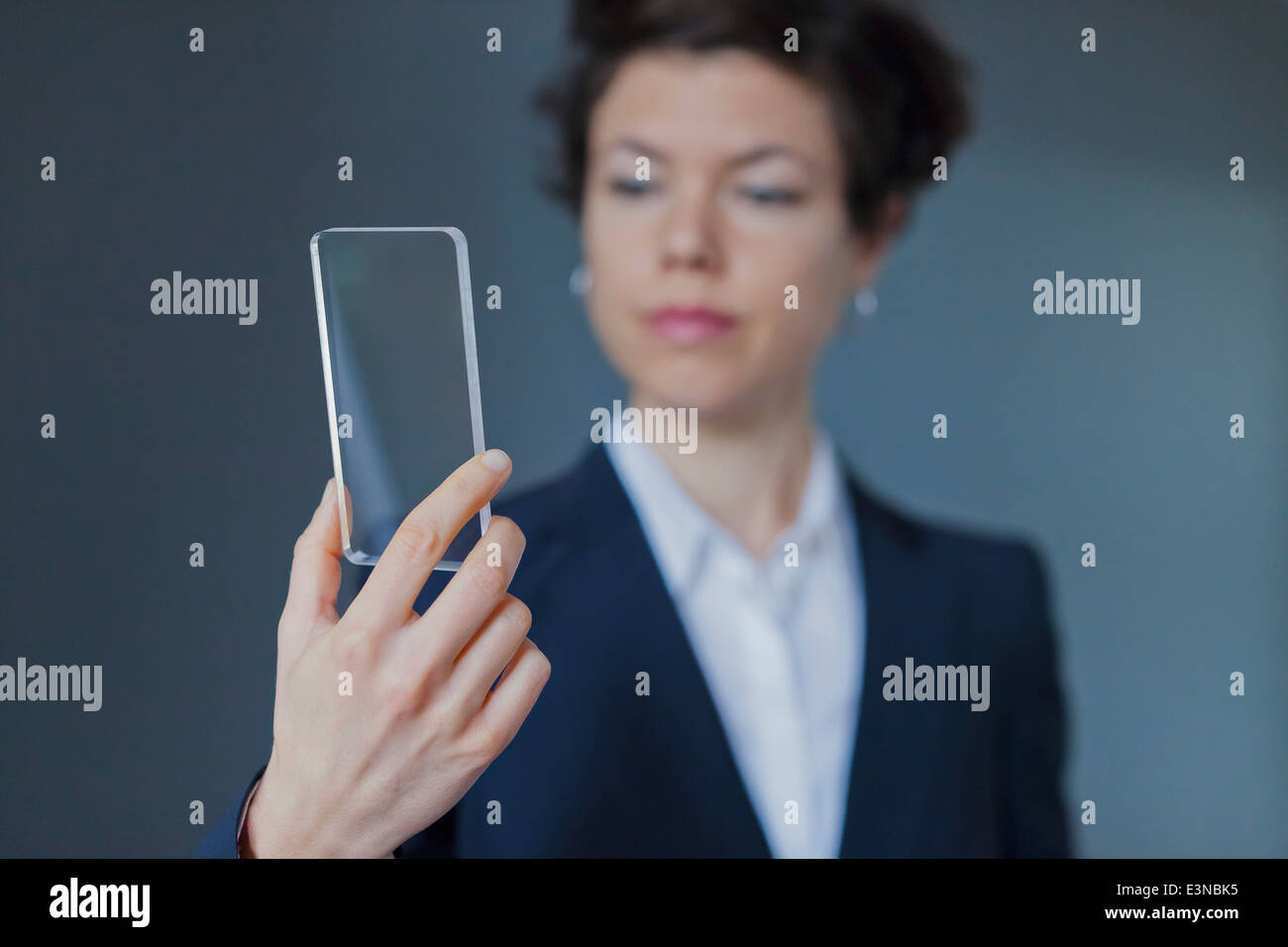 Professional businesswoman networking on smartphone hi-res stock ...