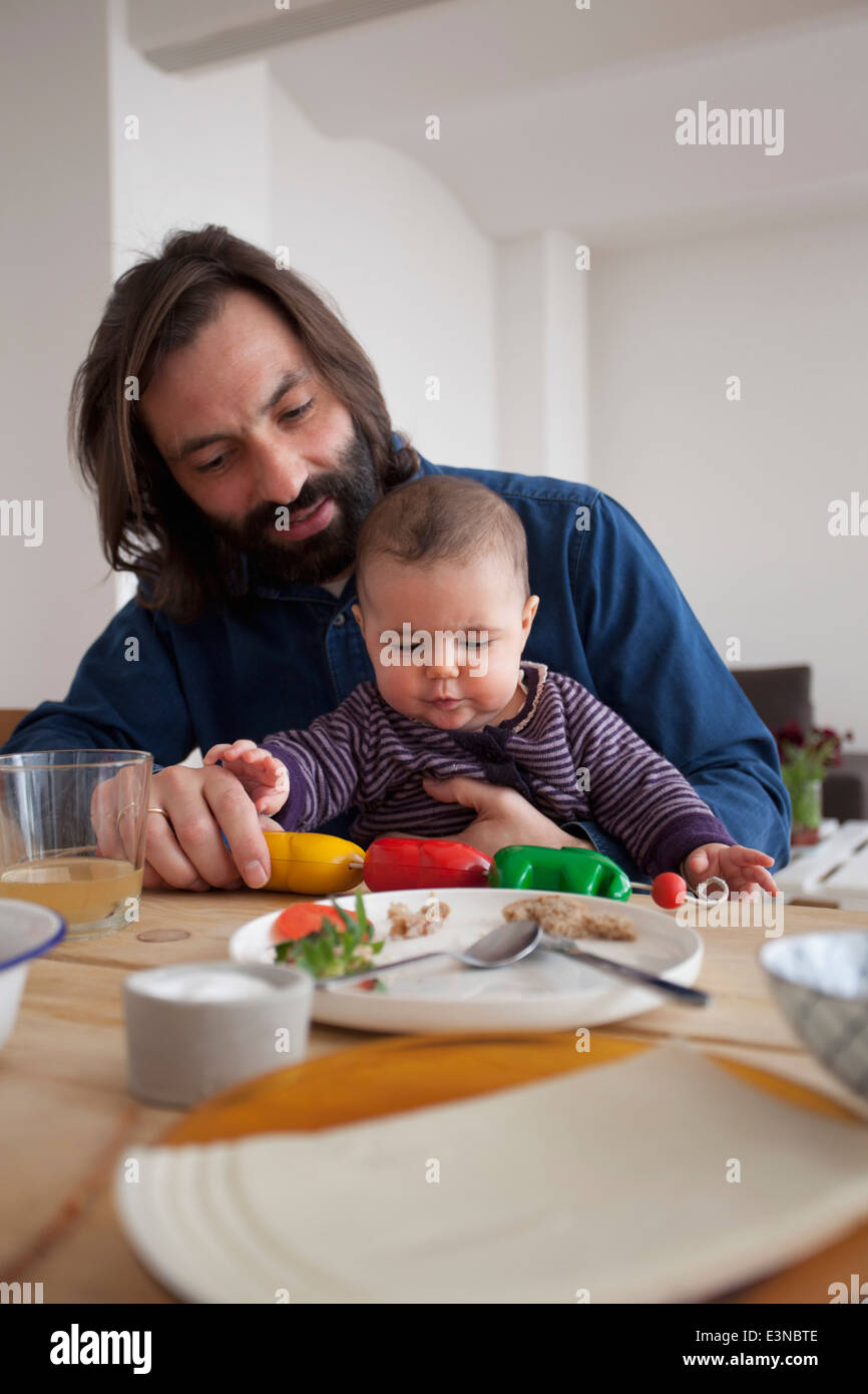 Baby looking under table hi-res stock photography and images - Alamy