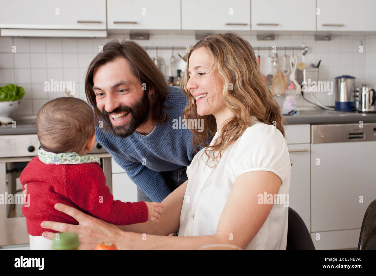 Parents standing in home hi-res stock photography and images - Alamy