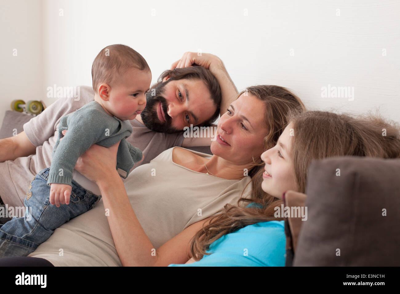 Family living room parents children hi-res stock photography and images ...