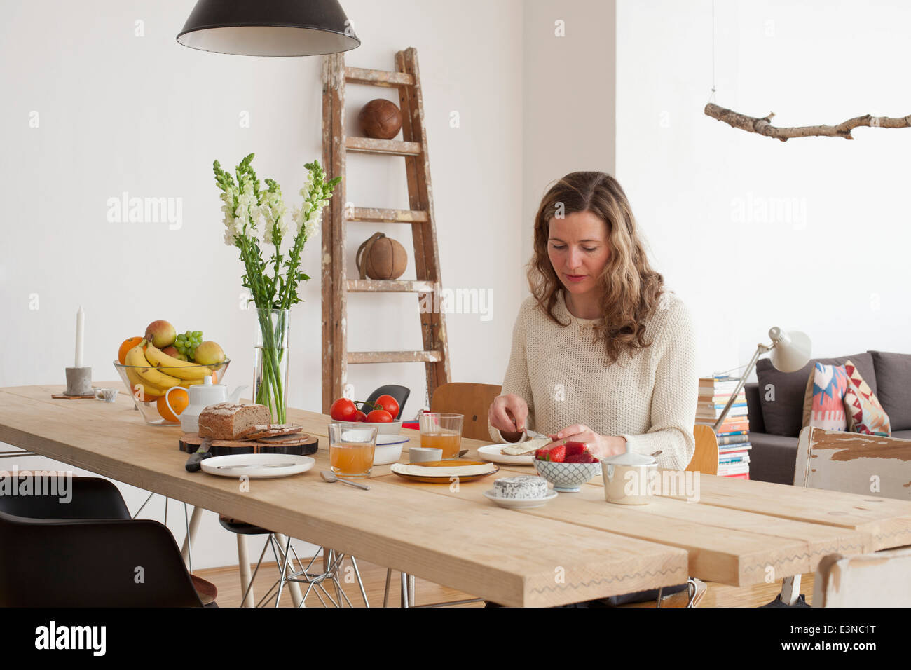 Woman sitting table having hi-res stock photography and images - Alamy