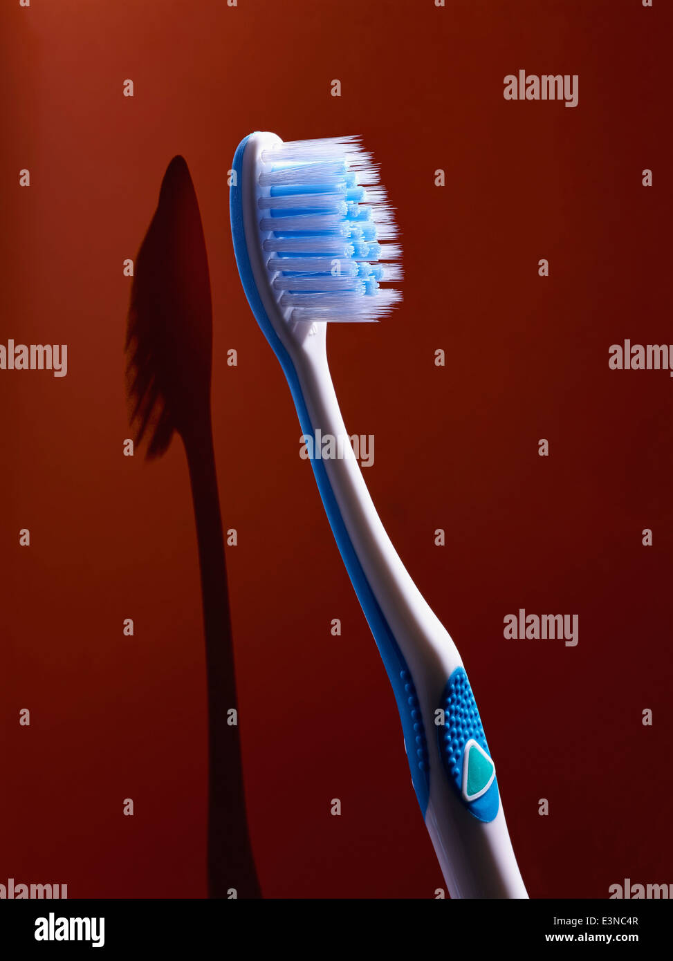 Toothbrush over red background Stock Photo - Alamy