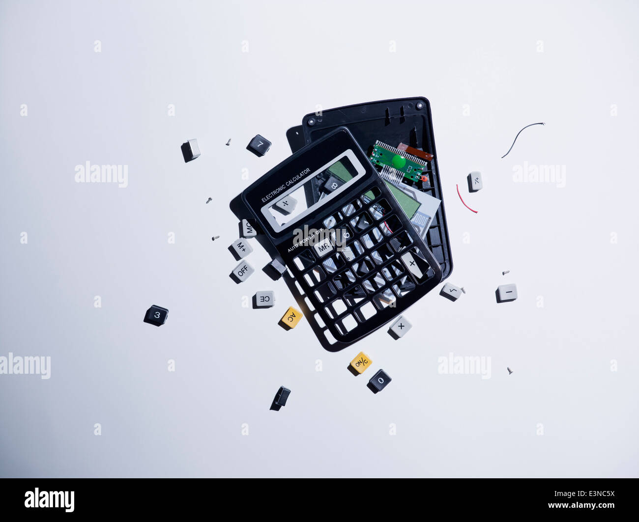 Broken calculator against gray background Stock Photo - Alamy
