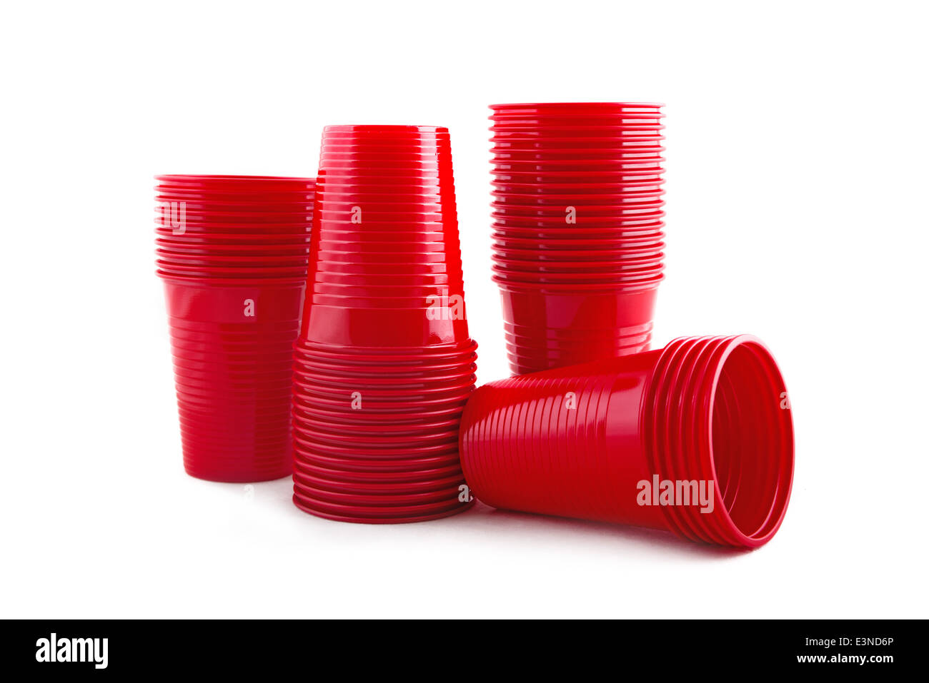 Plastic red cups stacks on white background Stock Photo - Alamy