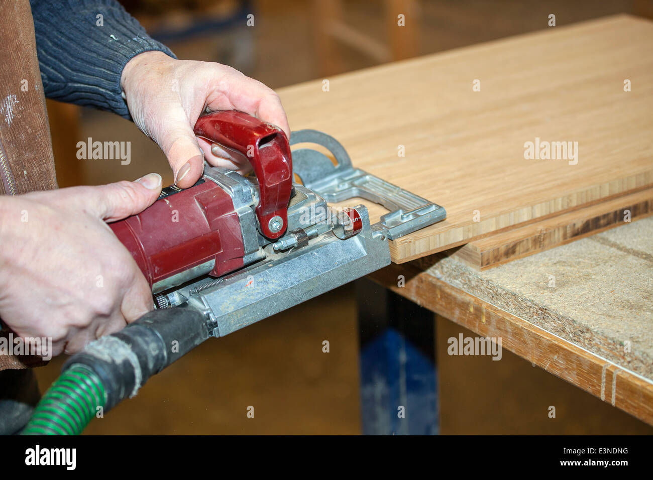 Close up of a carpenters hand working a machine in the workshop Stock ...