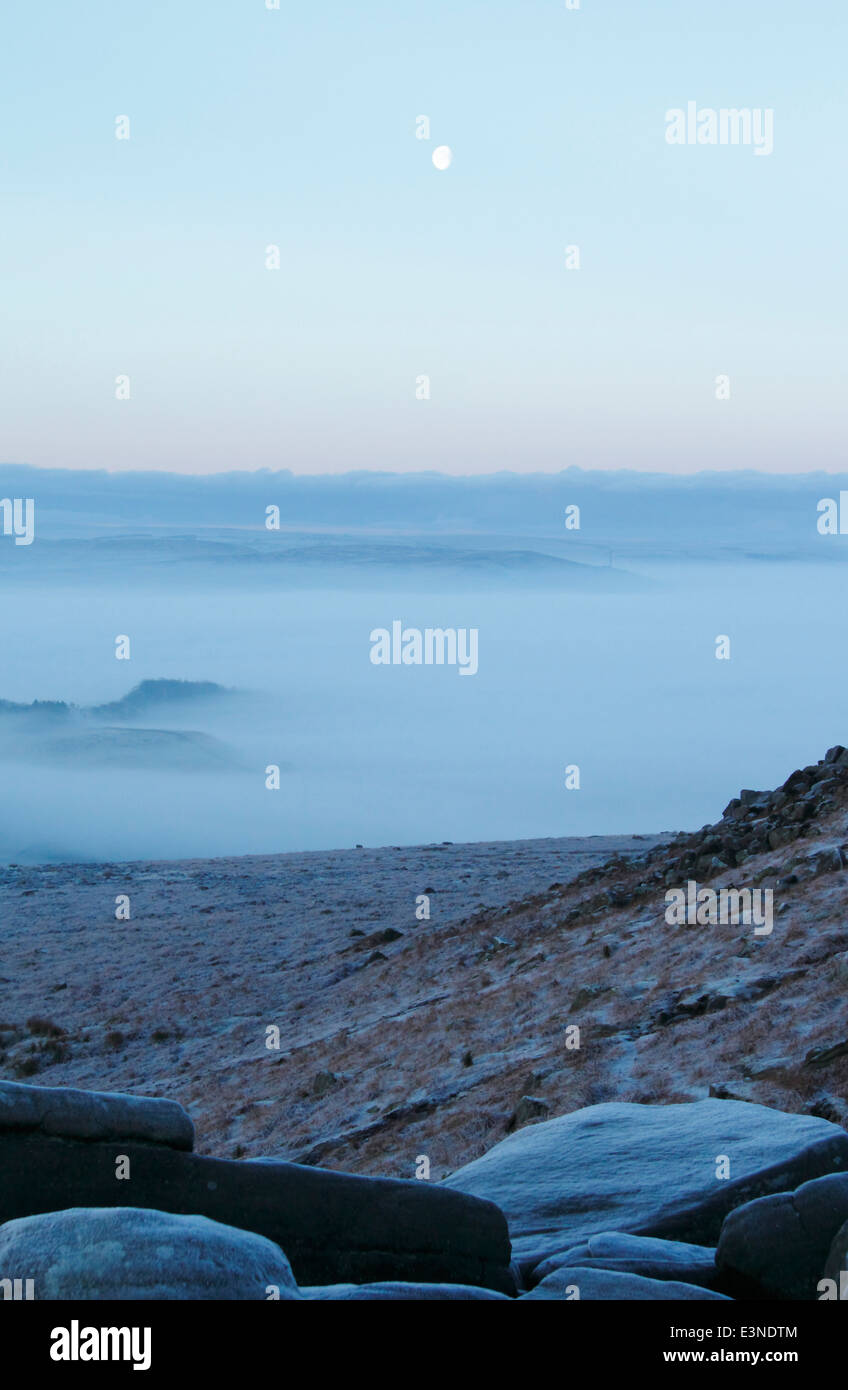 A glorious flush of blue pre-dawn light illuminates low lying cloud ...