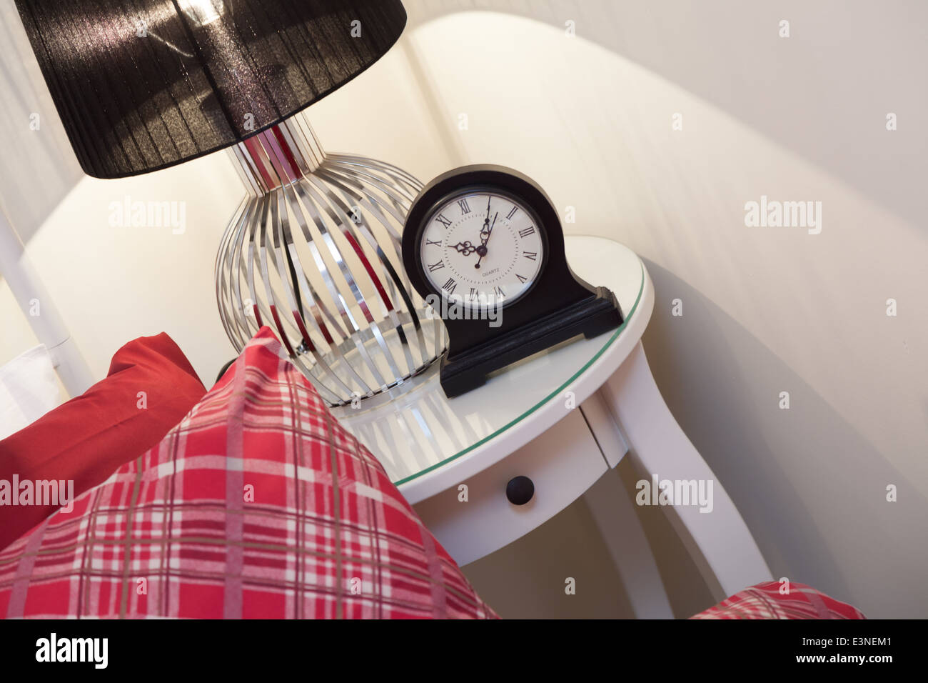 bedside table and clock Stock Photo - Alamy