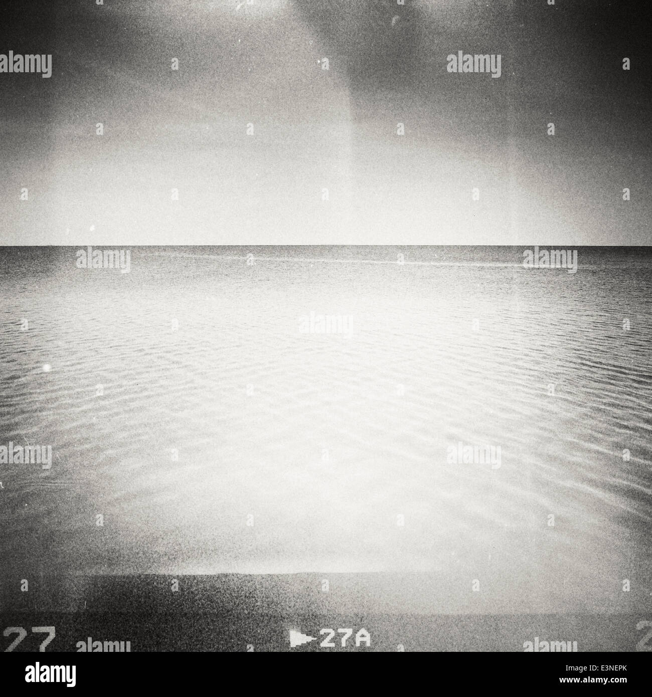 Designed retro photo. Sunny day on the beach. Grain, dust, colors added ...