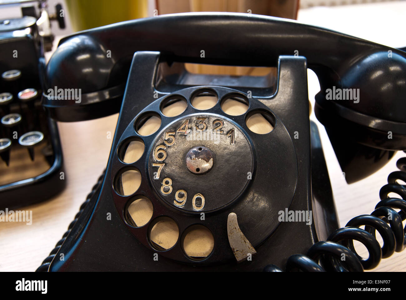 Vintage telephone standing on the desk in the office Stock Photo - Alamy