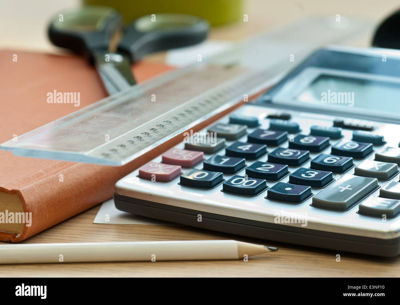 Office calculator and ruler lying on the desk in the office Stock Photo ...