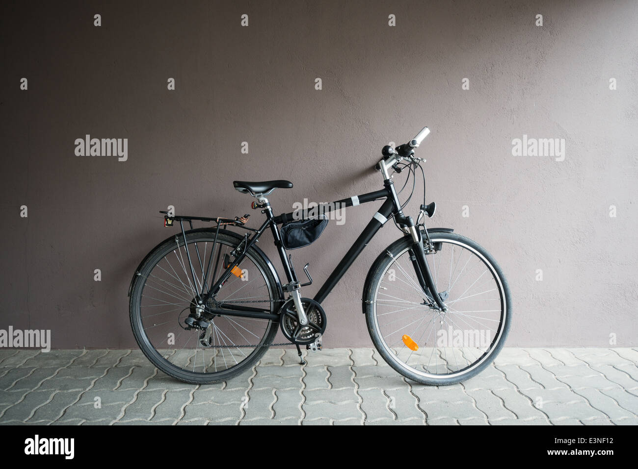 Bike against wall Stock Photo - Alamy