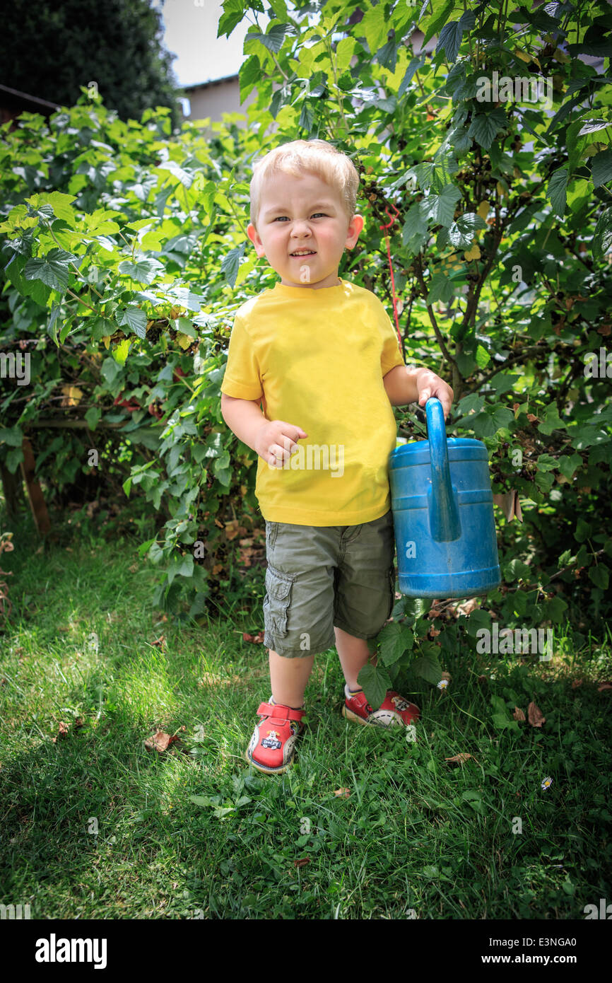 Boy working garden hi-res stock photography and images - Alamy