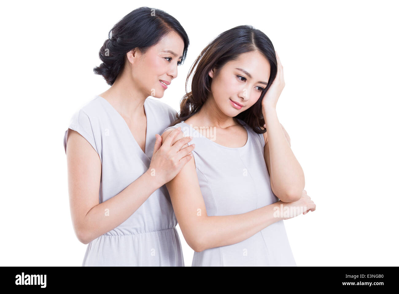Mother comforting daughter Stock Photo - Alamy