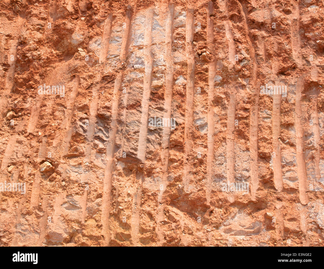 Clay background vertical texture of red dry clay Stock Photo - Alamy
