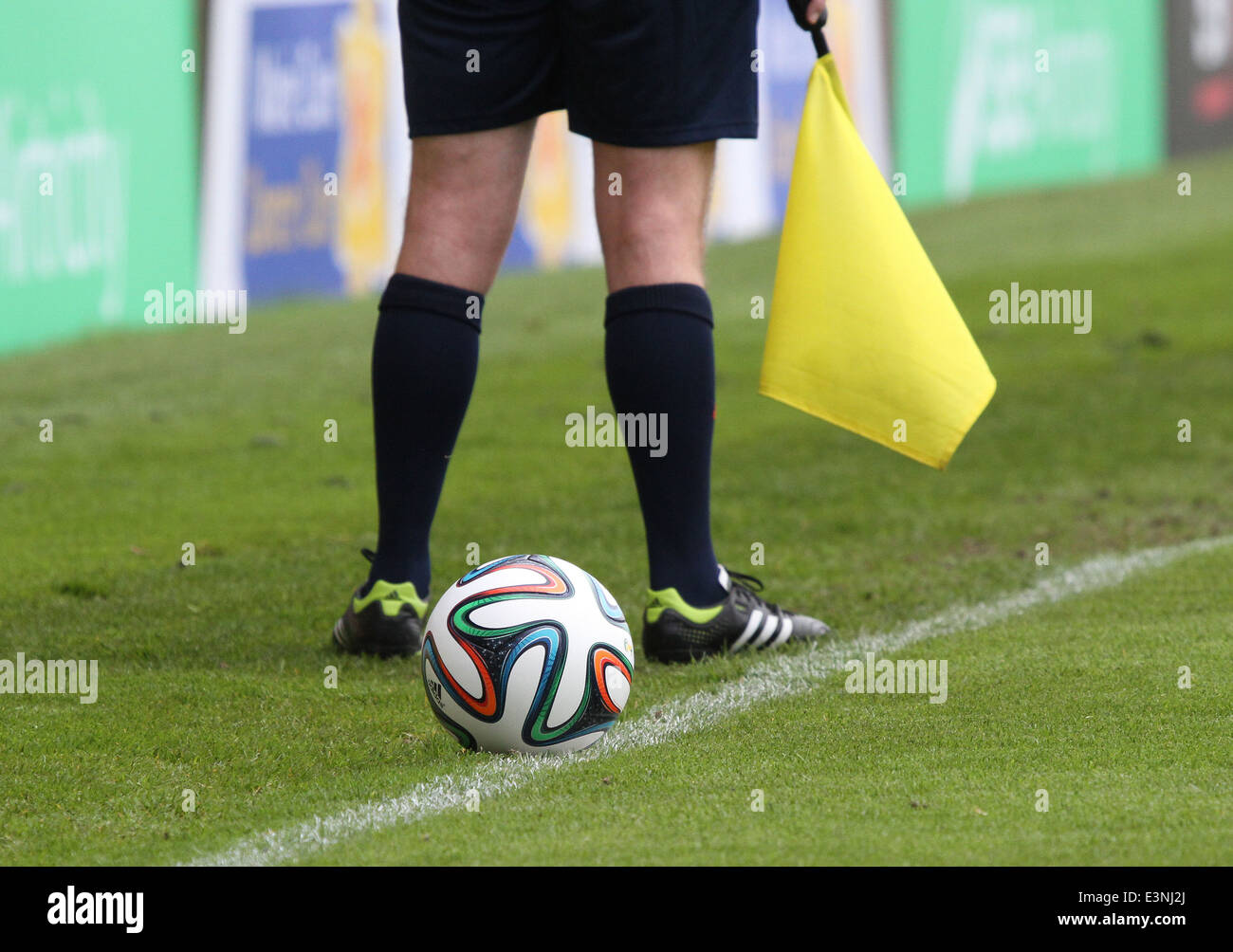 A football at side of pitch with referee's assistant behind it Stock ...