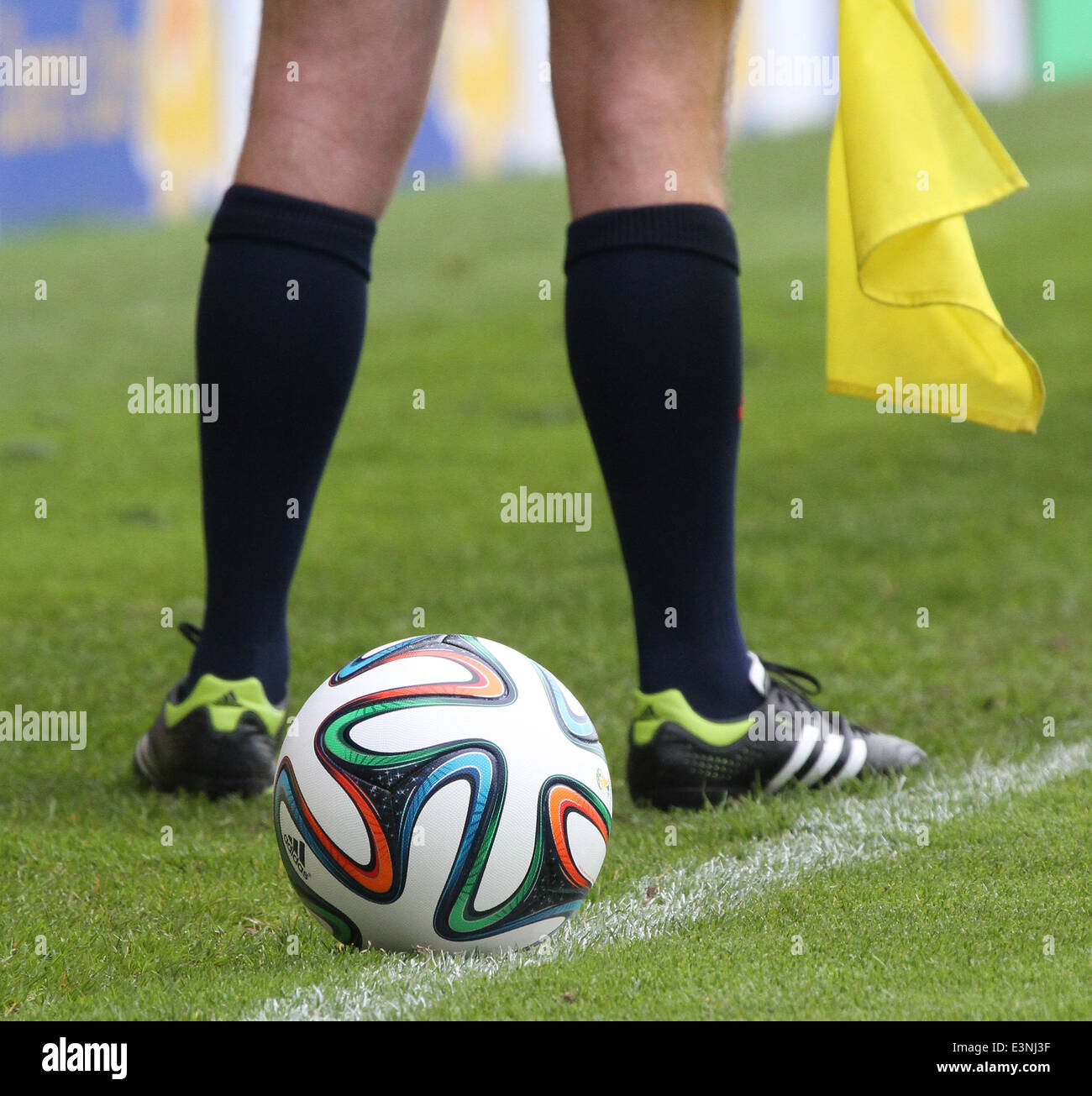 A football at side of pitch with referee's assistant behind it Stock ...
