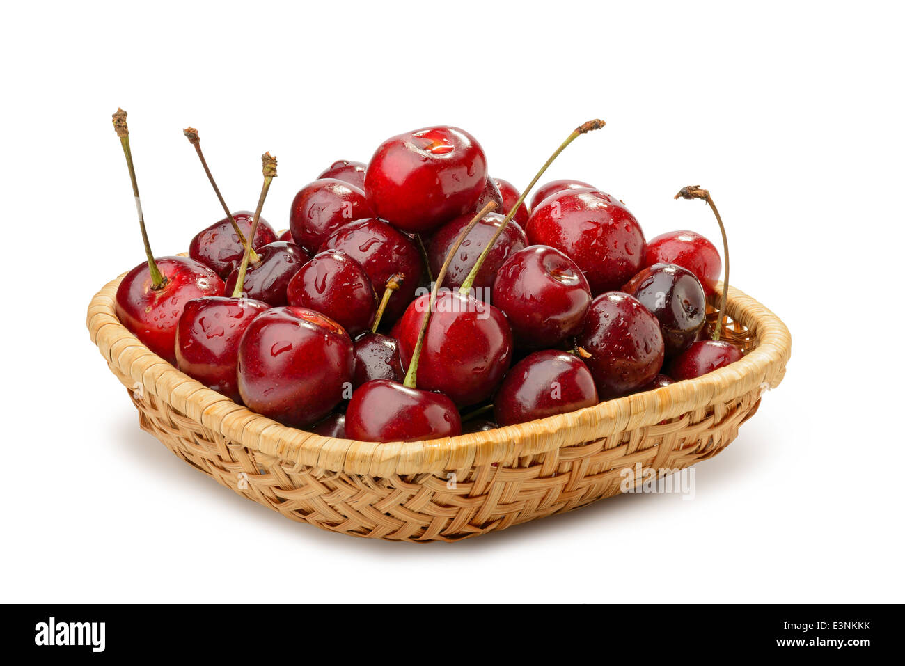 A heap of red fresh and natural cherries in a rattan basket Stock Photo ...