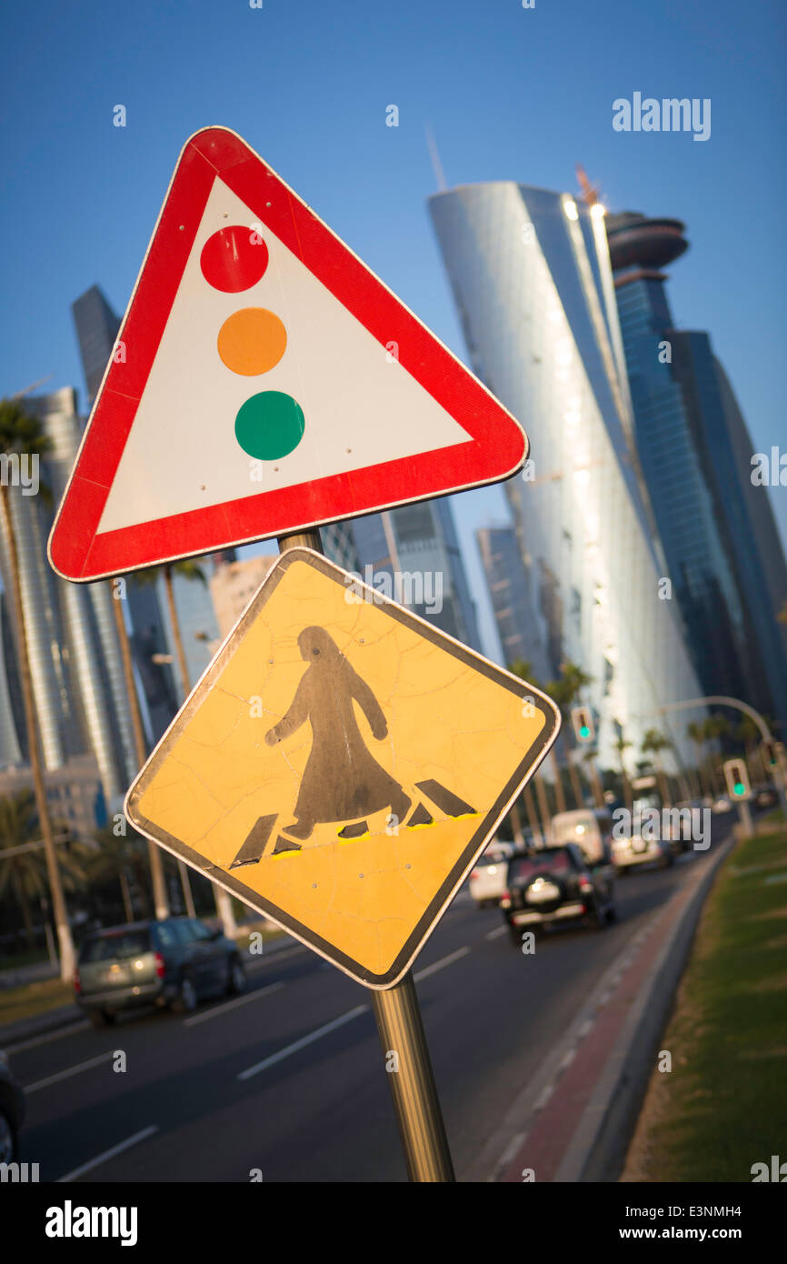 Doha, Qatar, road sign and new skyline of the West Bay central ...