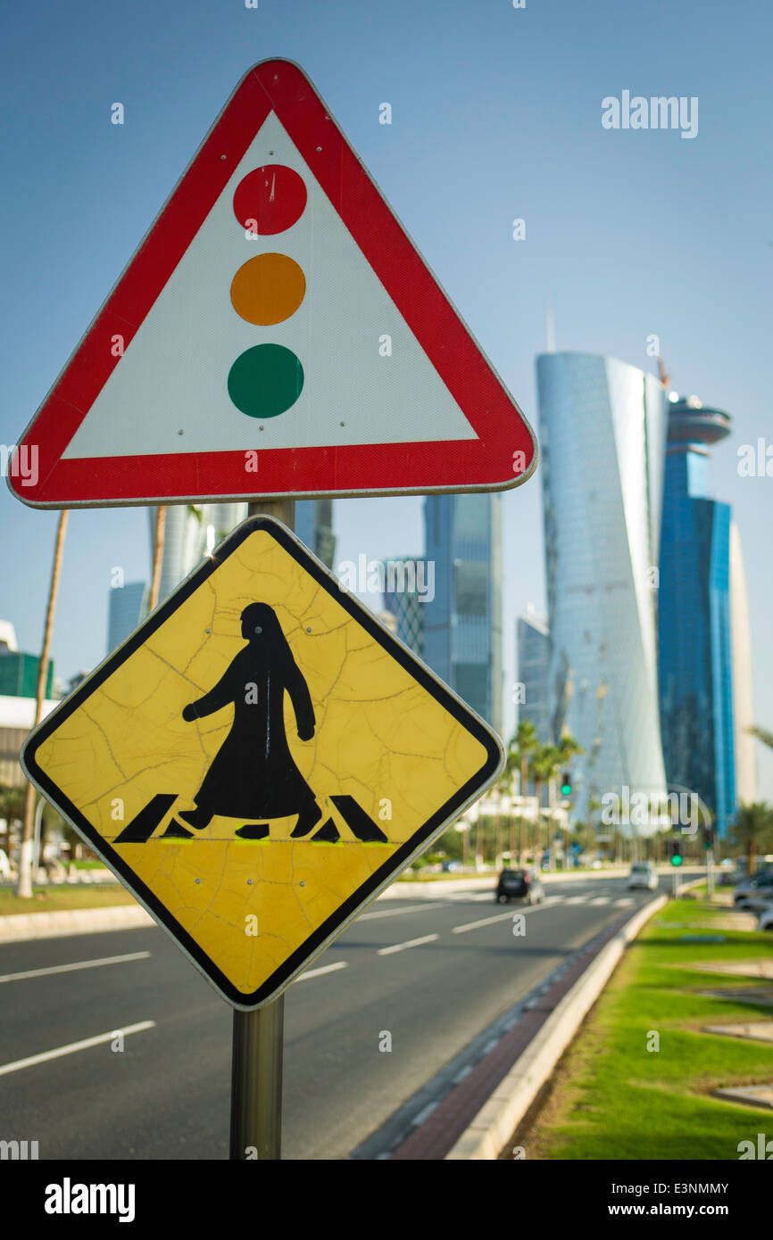 Doha, Qatar, road sign and new skyline of the West Bay central ...