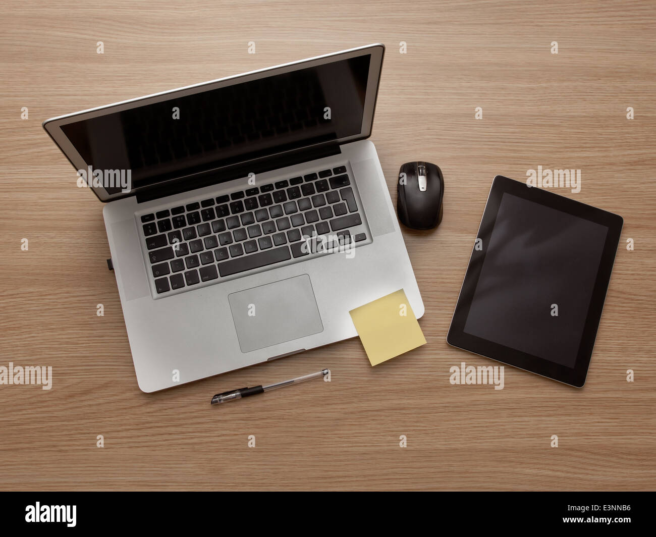 Modern desk with laptop and tablet Stock Photo - Alamy